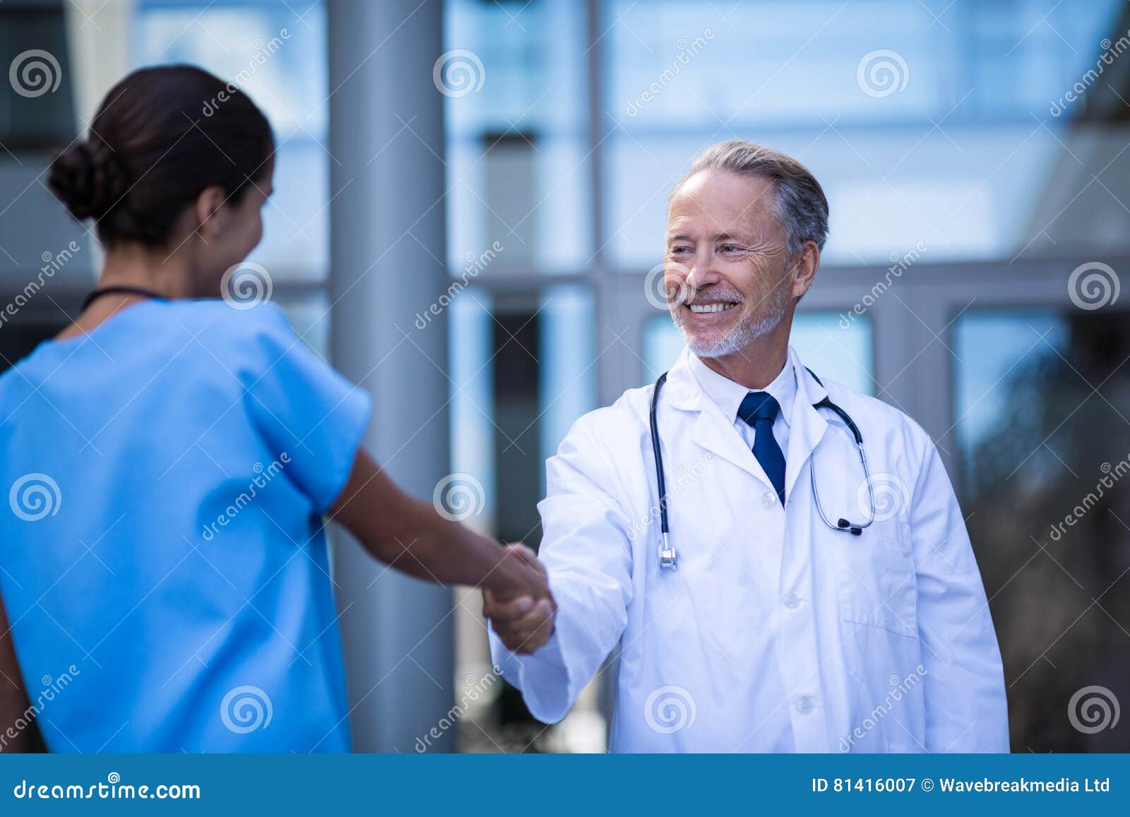 A Nurse Shaking Hands To Encourage The Patient Royalty-Free Stock Image ...