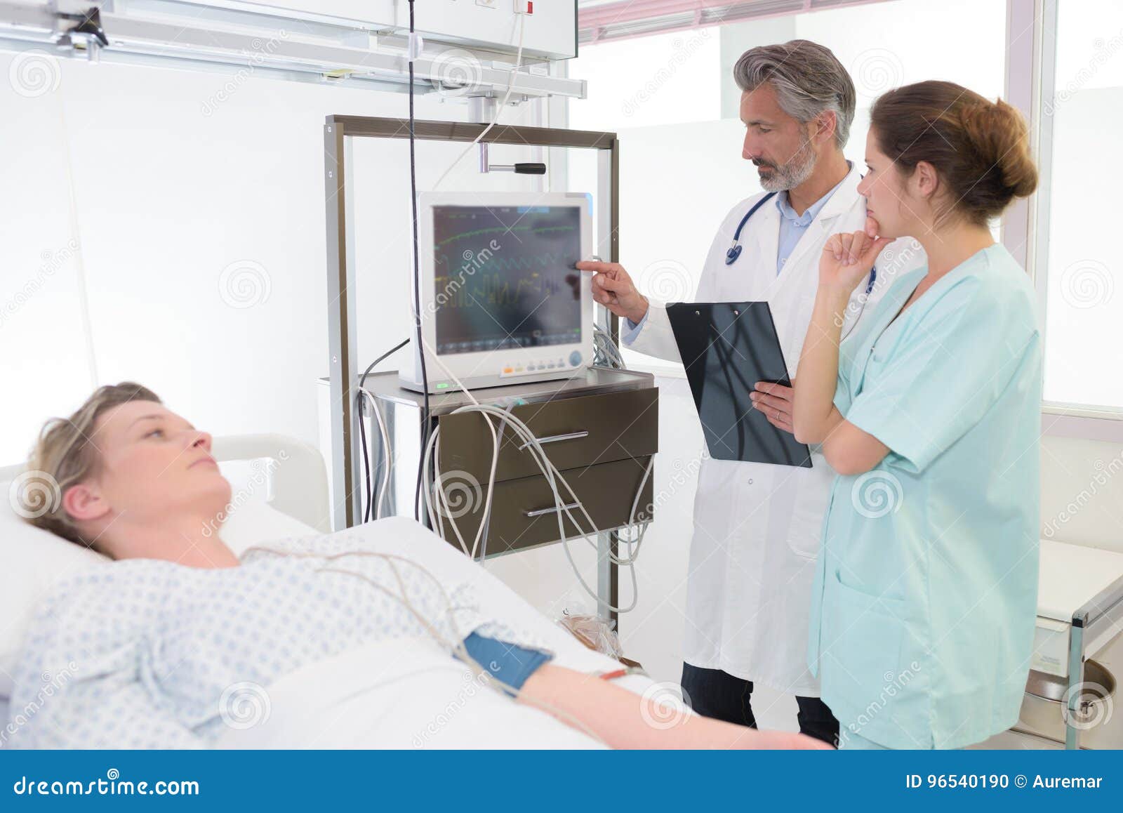 Doctor and Nurse Visiting Recovering Patient Stock Photo - Image of ...