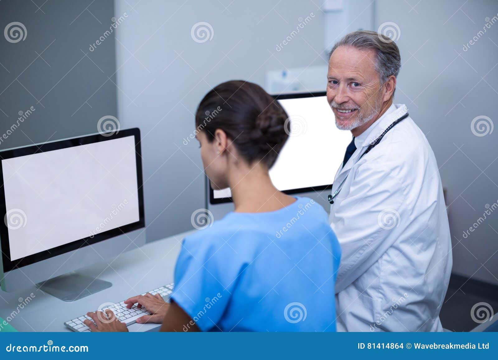 Doctor and Nurse Working on Computer Stock Photo - Image of scrubs ...
