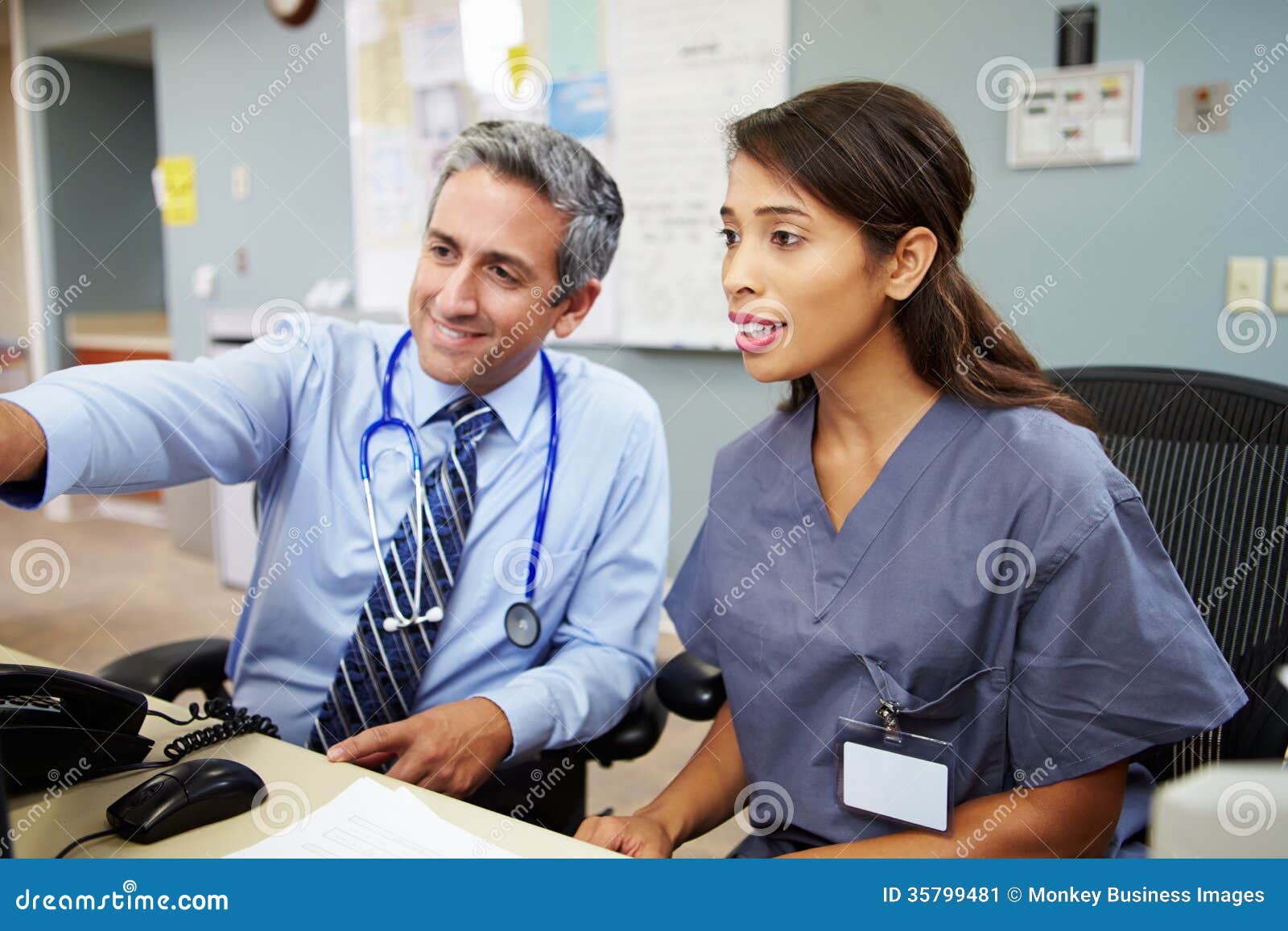Doctor With Nurse Working At Nurses Station Stock Image | CartoonDealer ...