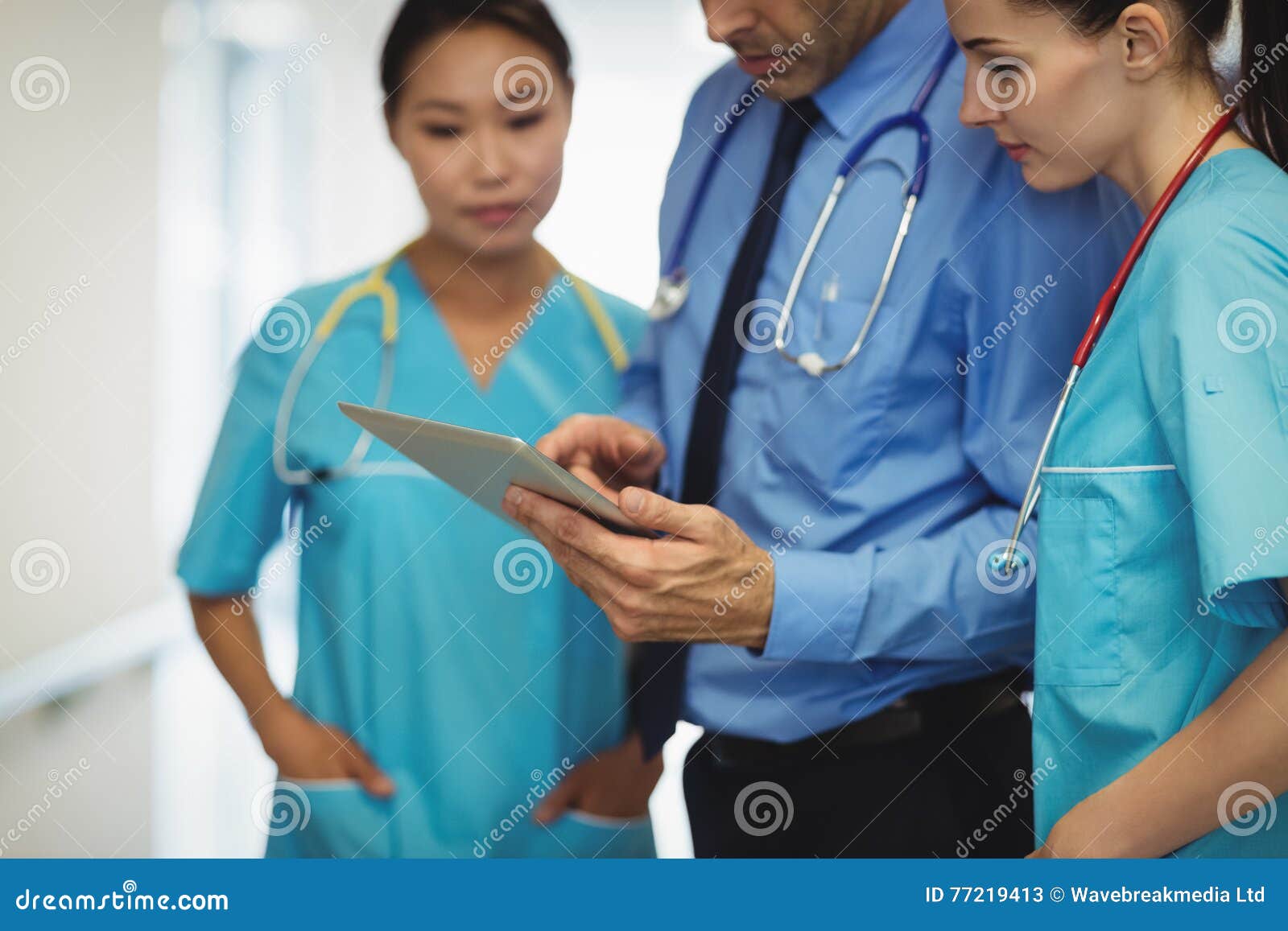 Doctor and Nurses Discussing Over Digital Tablet Stock Image - Image of ...