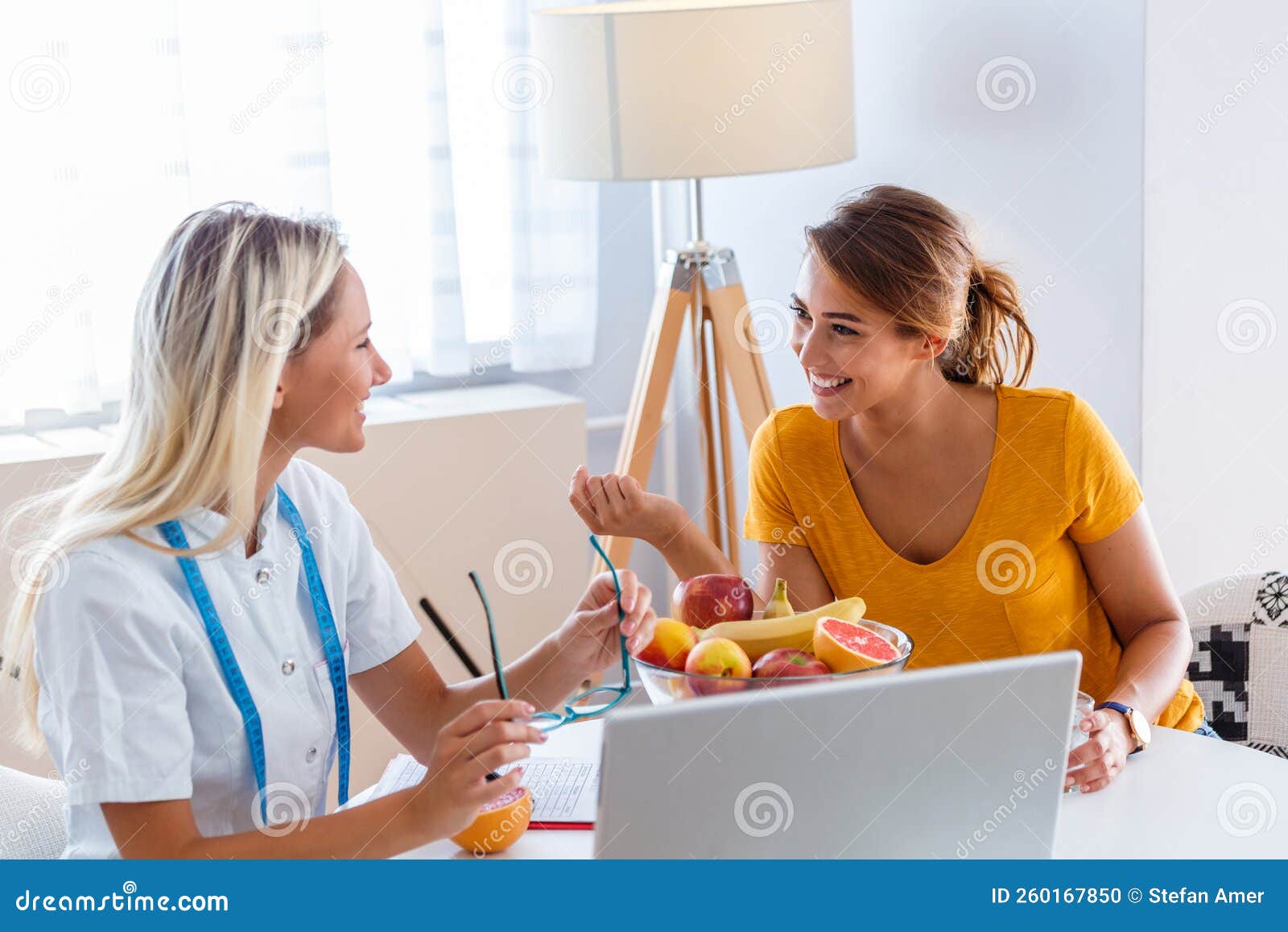 Doctor Nutritionist Dietician And Female Patient On Consultation In