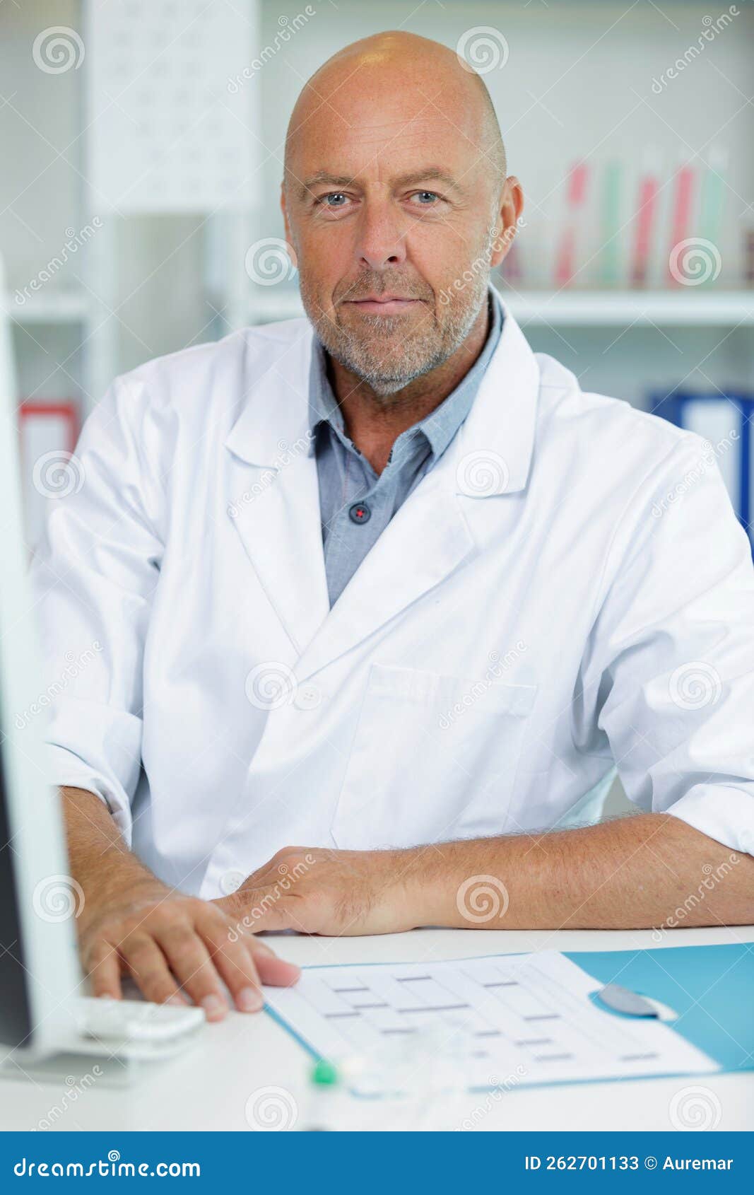 Doctor in Office Working on Patient File Stock Image - Image of ...