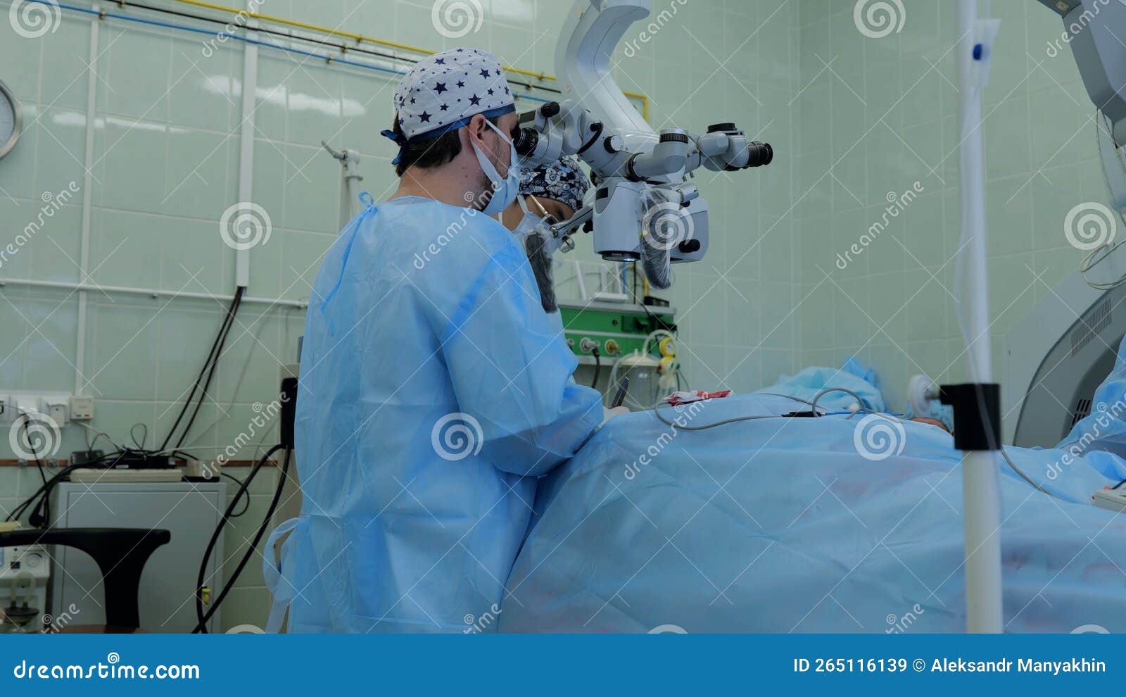 The Doctor Operates Using a Microscope during Nerve Surgery. the ...