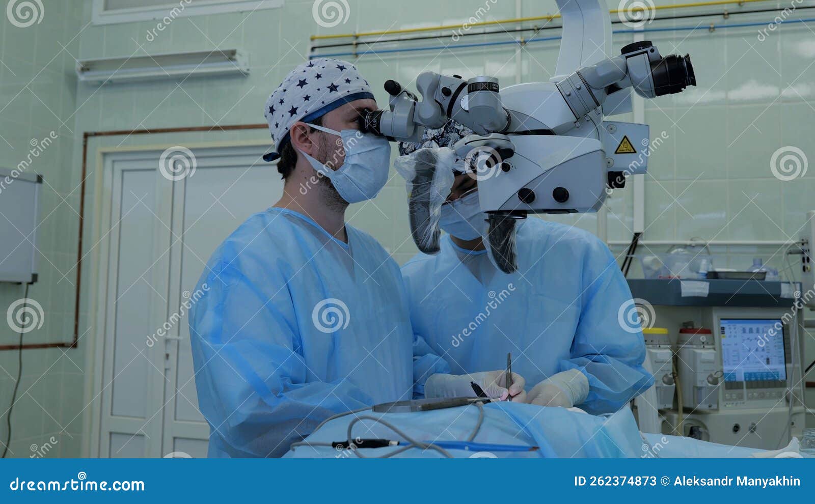 The Doctor Operates Using a Microscope during Nerve Surgery. the ...