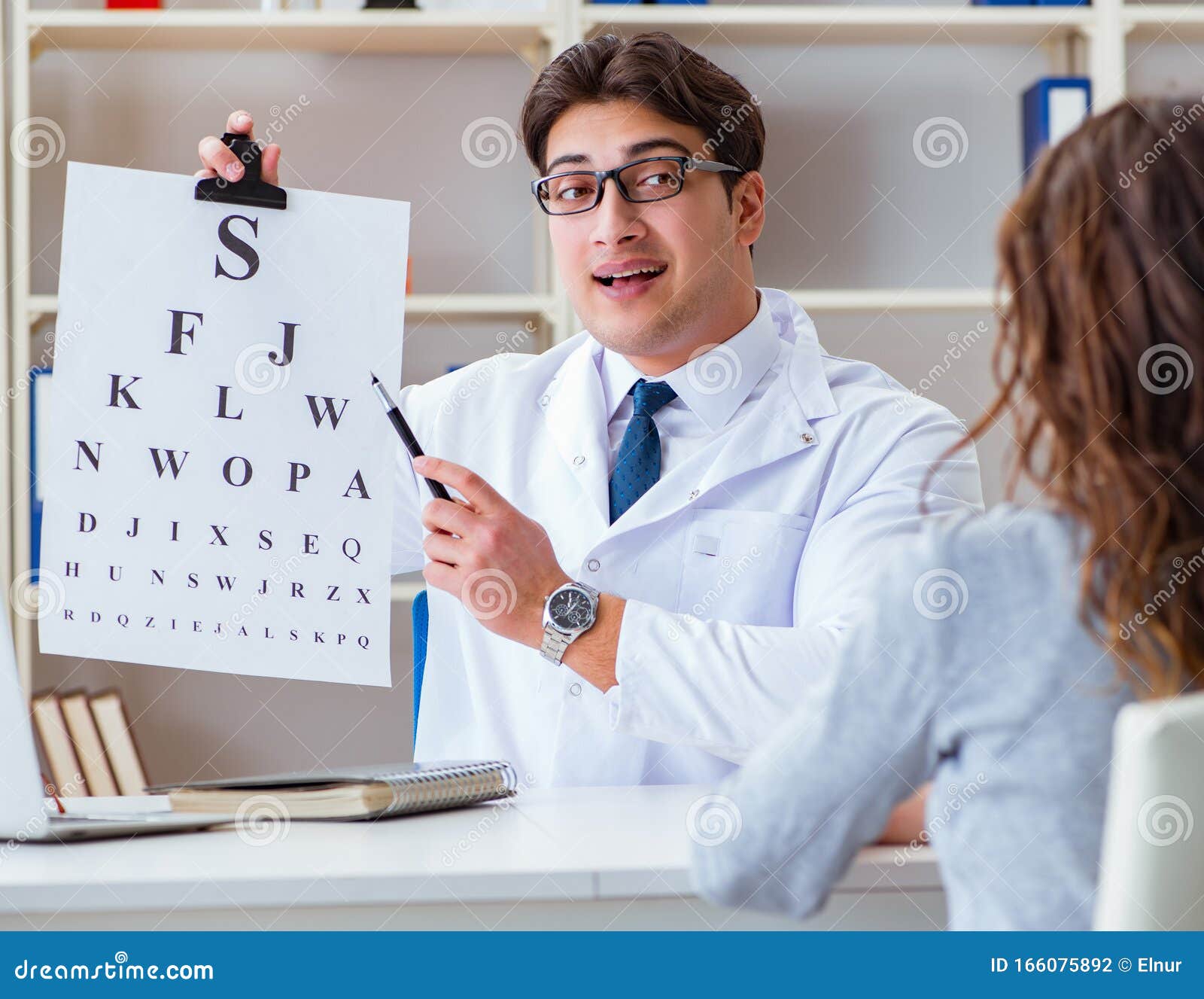 Doctor Optician with Letter Chart Conducting an Eye Test Check Stock ...