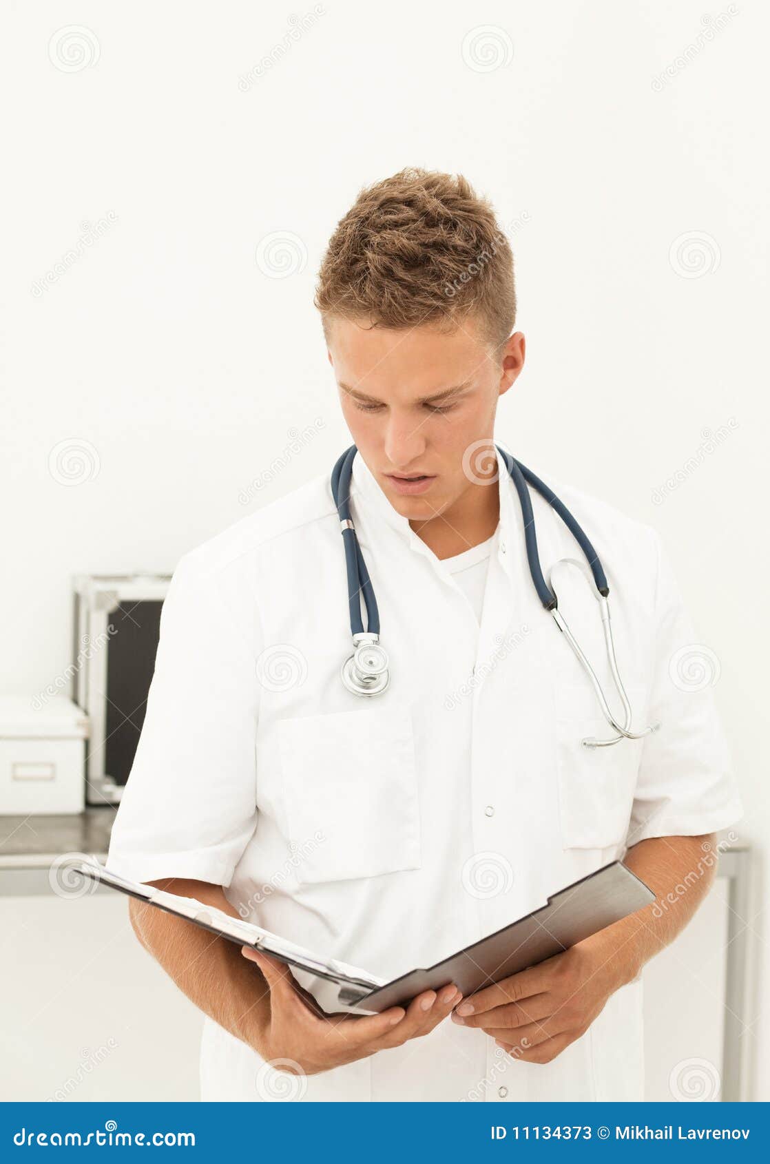 Doctor with papers stock image. Image of handsome, young - 11134373
