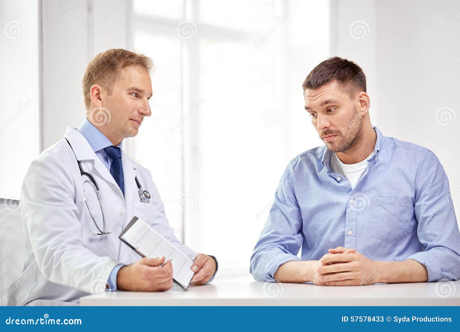 Doctor And Patient With Cardiogram On Clipboard Stock Image Image Of