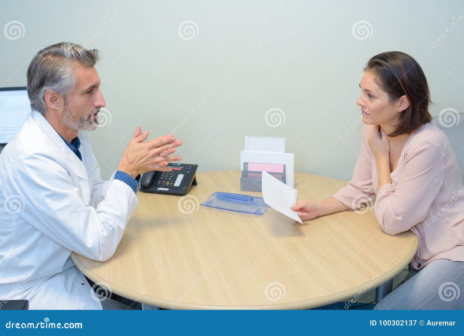 Doctor and Patient Discussing Something Stock Image - Image of close ...