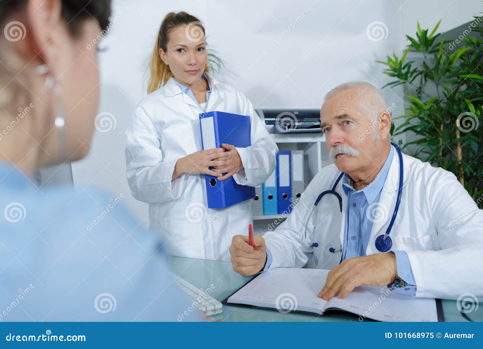 Doctor and Patient Discussing Something Stock Image - Image of hands ...