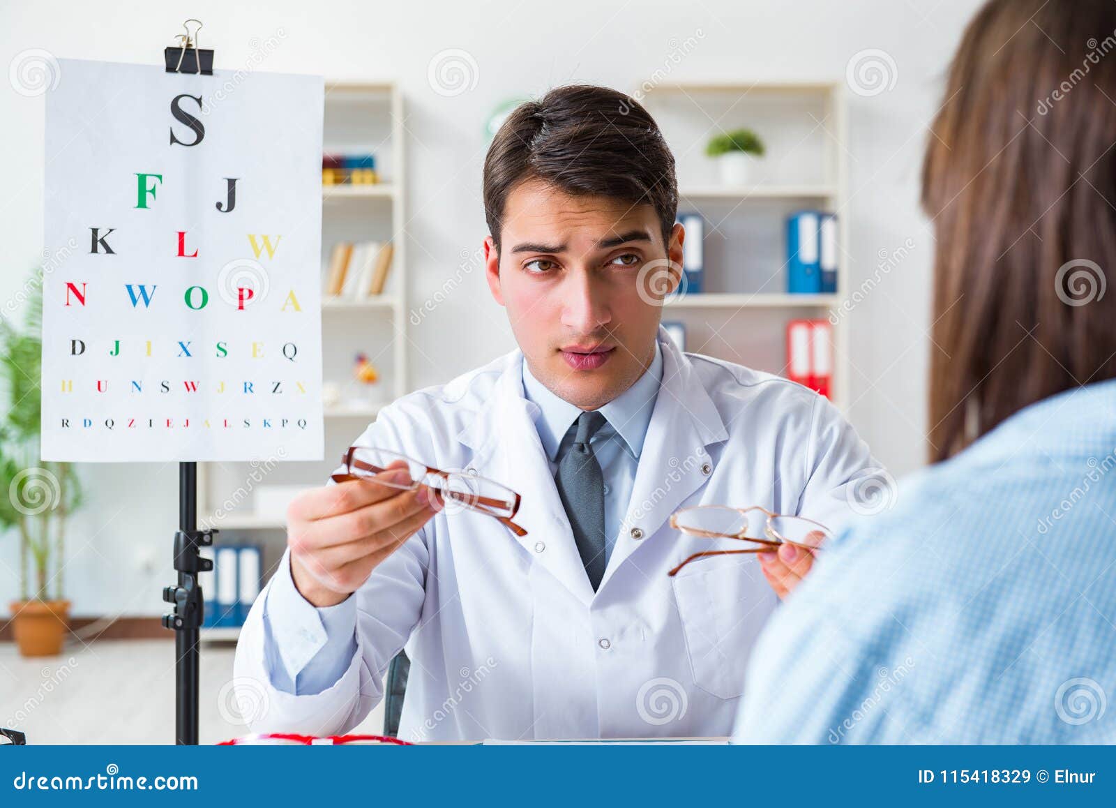 The Doctor with Patient at Eye Exam Stock Image - Image of issue ...