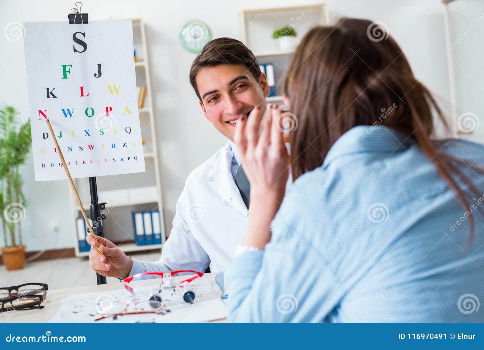 The Doctor with Patient at Eye Exam Stock Image - Image of eyeglasses ...