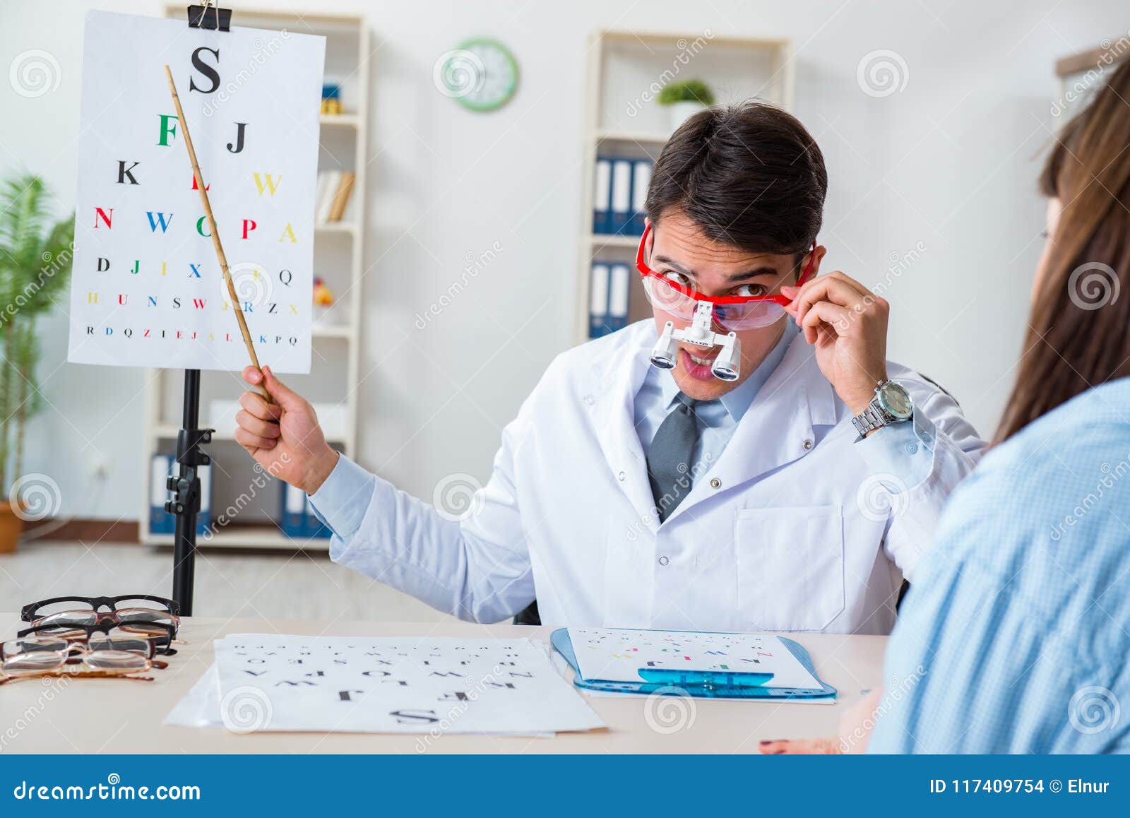 The Doctor with Patient at Eye Exam Stock Photo - Image of ...