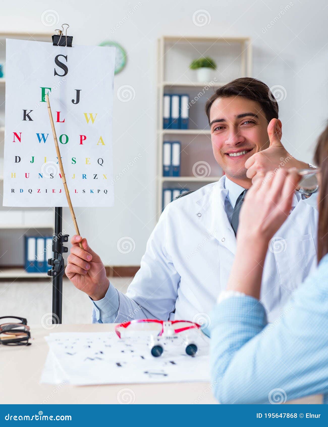 Doctor with Patient at Eye Exam Stock Photo - Image of clinic, doctor ...
