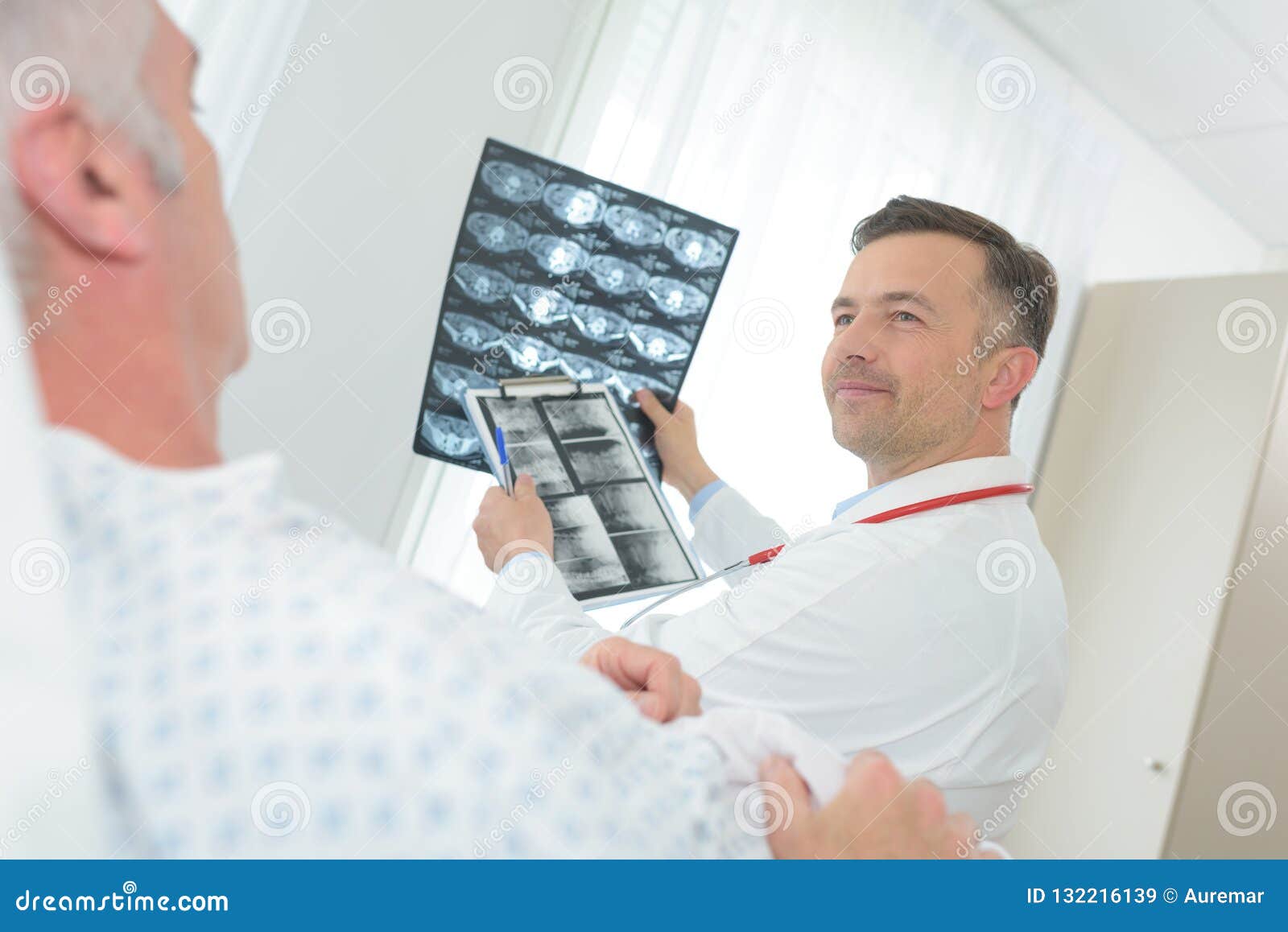Doctor with Patient Looking at X-ray Stock Image - Image of healthy ...