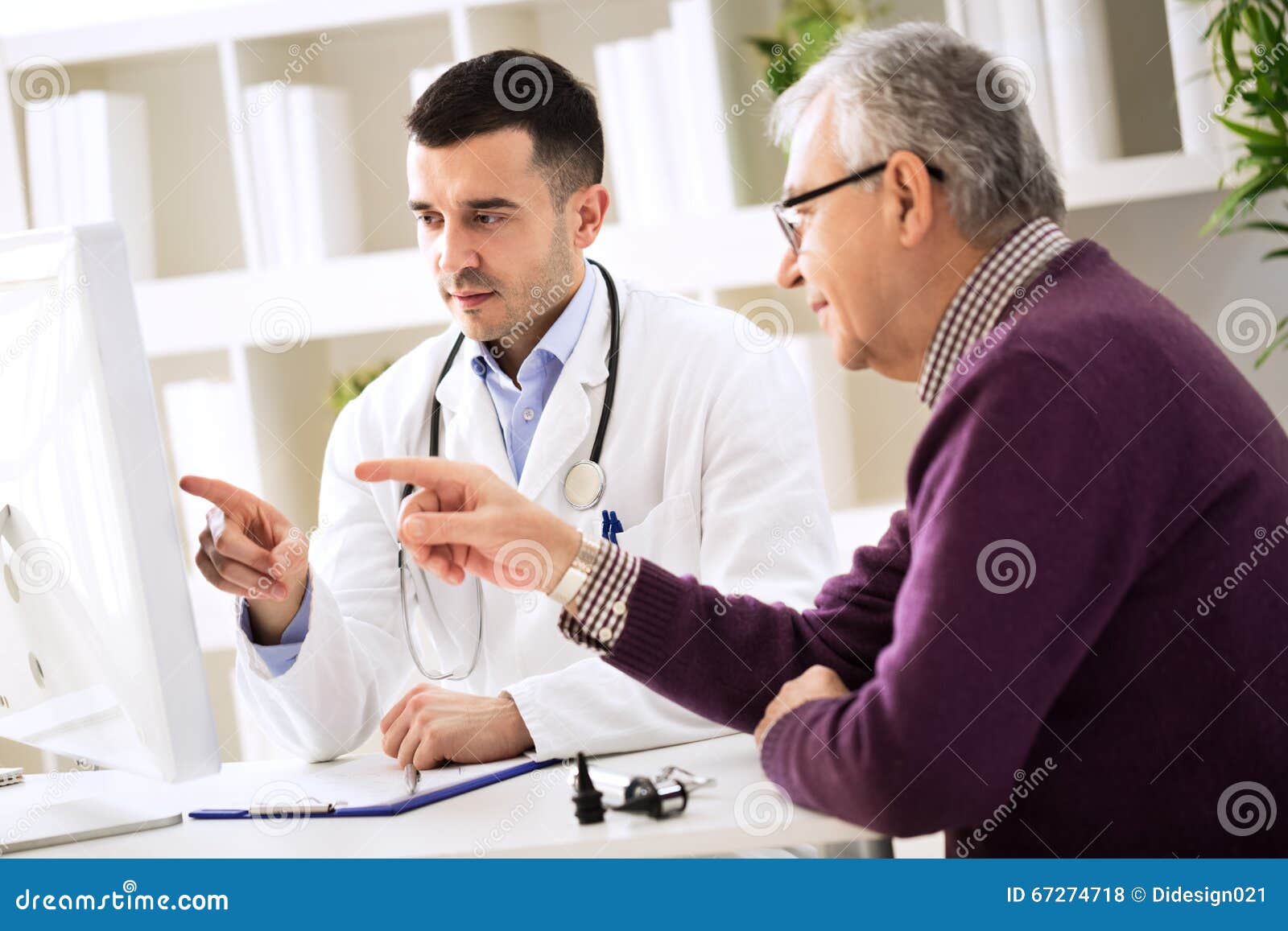 Doctor and Patient Pointing on Computer Stock Photo - Image of happy ...