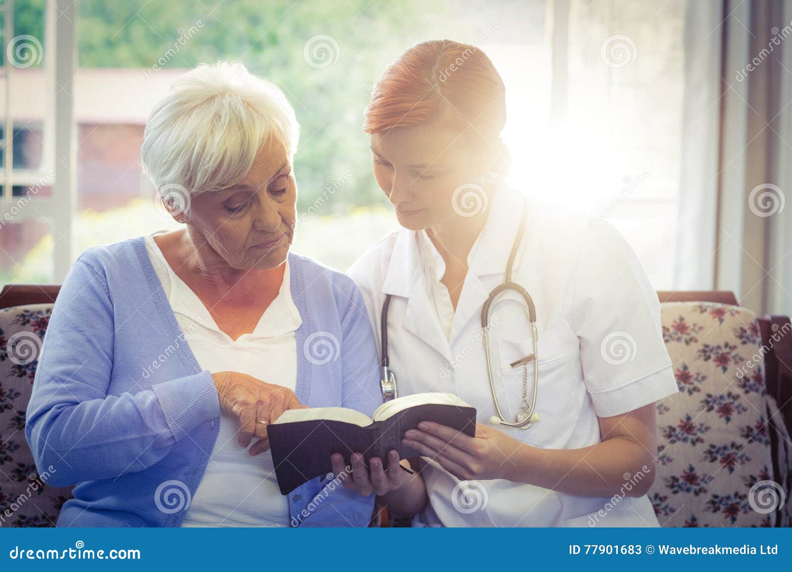 Doctor and Patient Reading a Book Stock Image - Image of home ...
