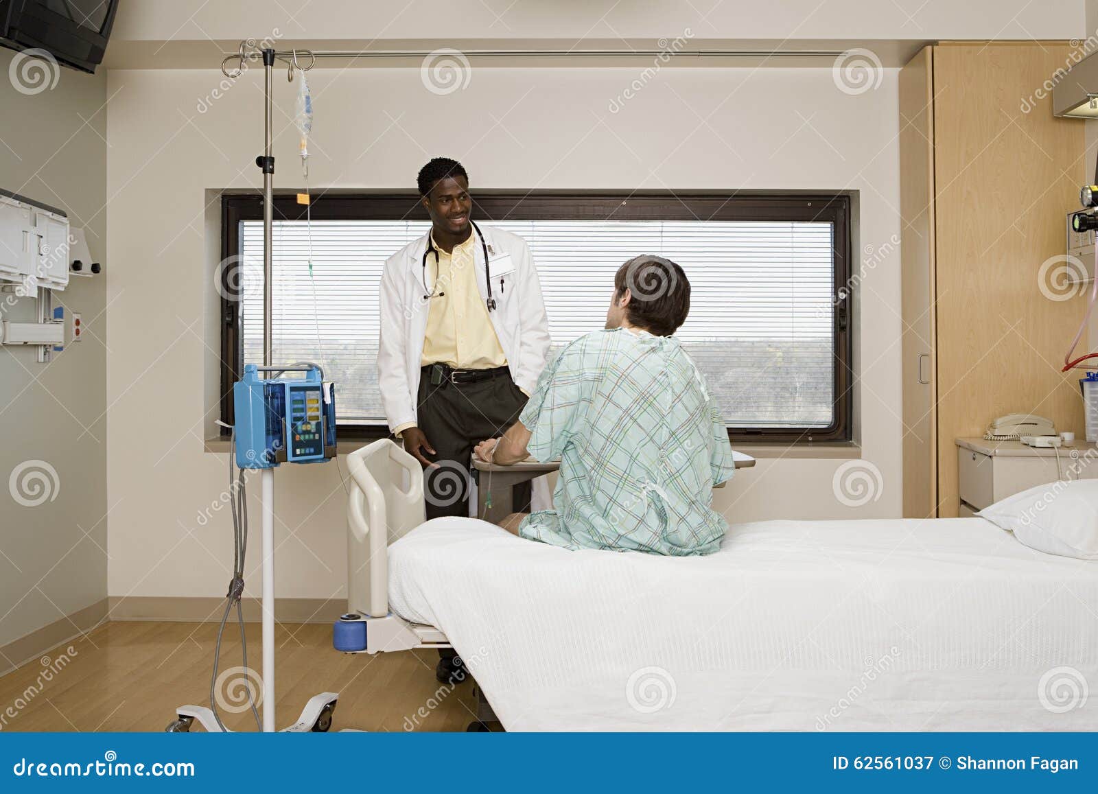 Doctor and patient in room stock image. Image of american - 62561037
