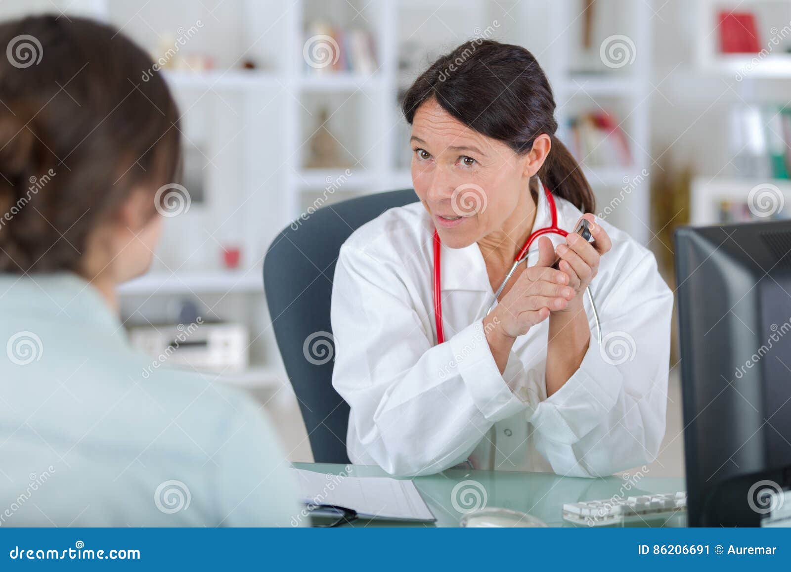 Doctor and Patient Sitting at Desk Stock Image - Image of physician ...