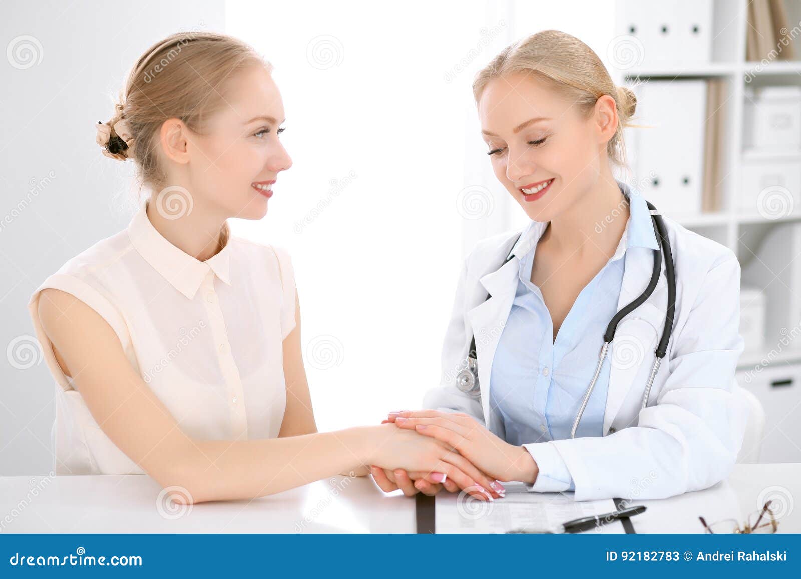 Doctor and Patient Sitting at the Desk Stock Image - Image of female ...