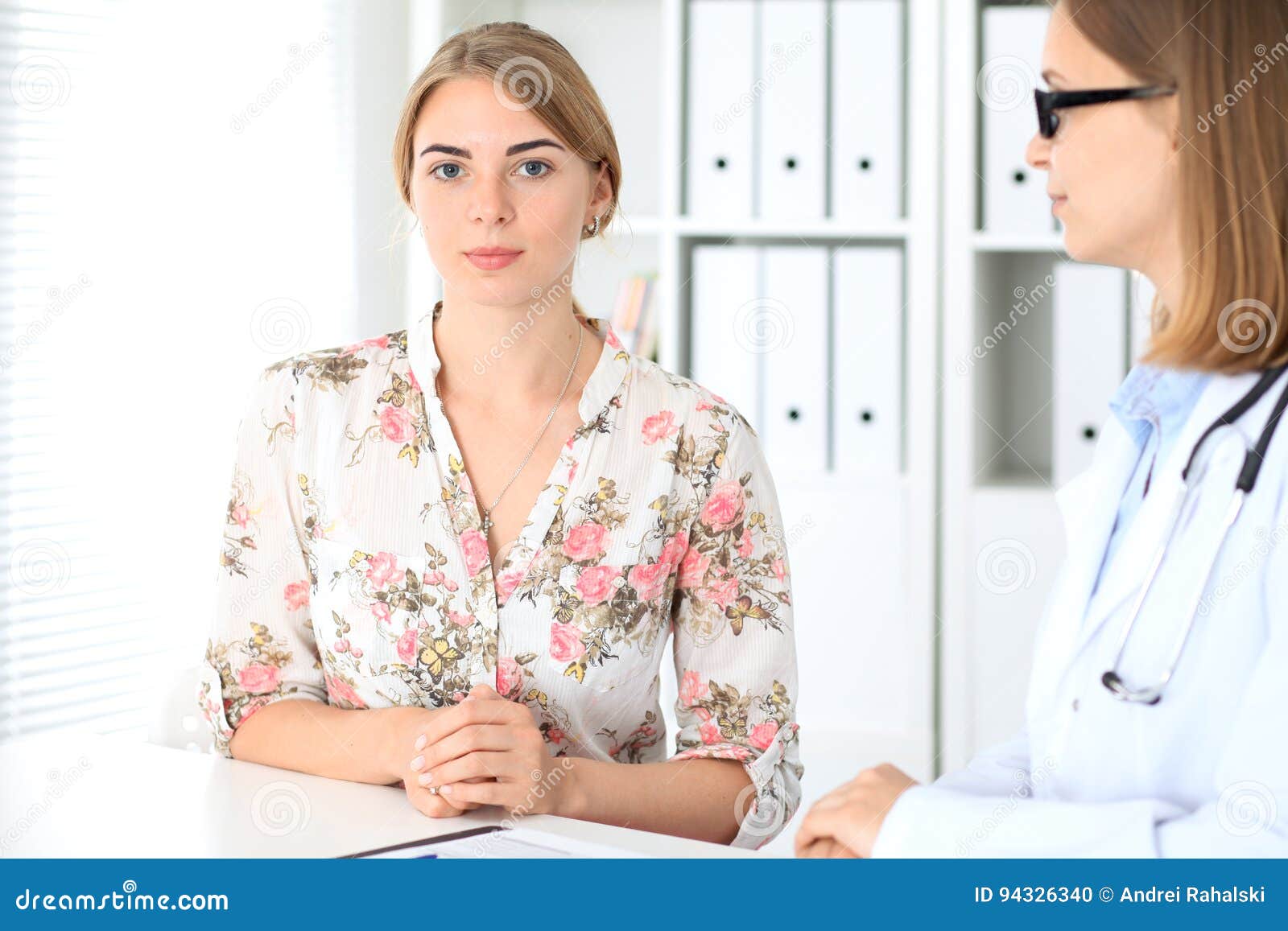 Doctor and Patient Sitting at the Desk Stock Photo - Image of diagnosis ...