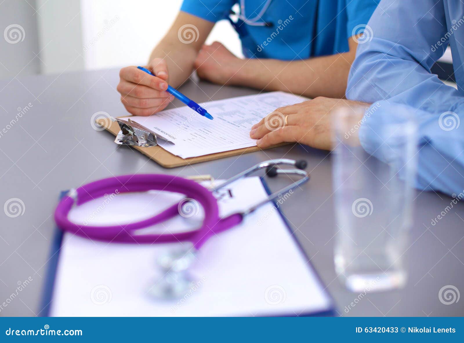 Doctor and Patient at the Table. Solution Stock Image - Image of male ...