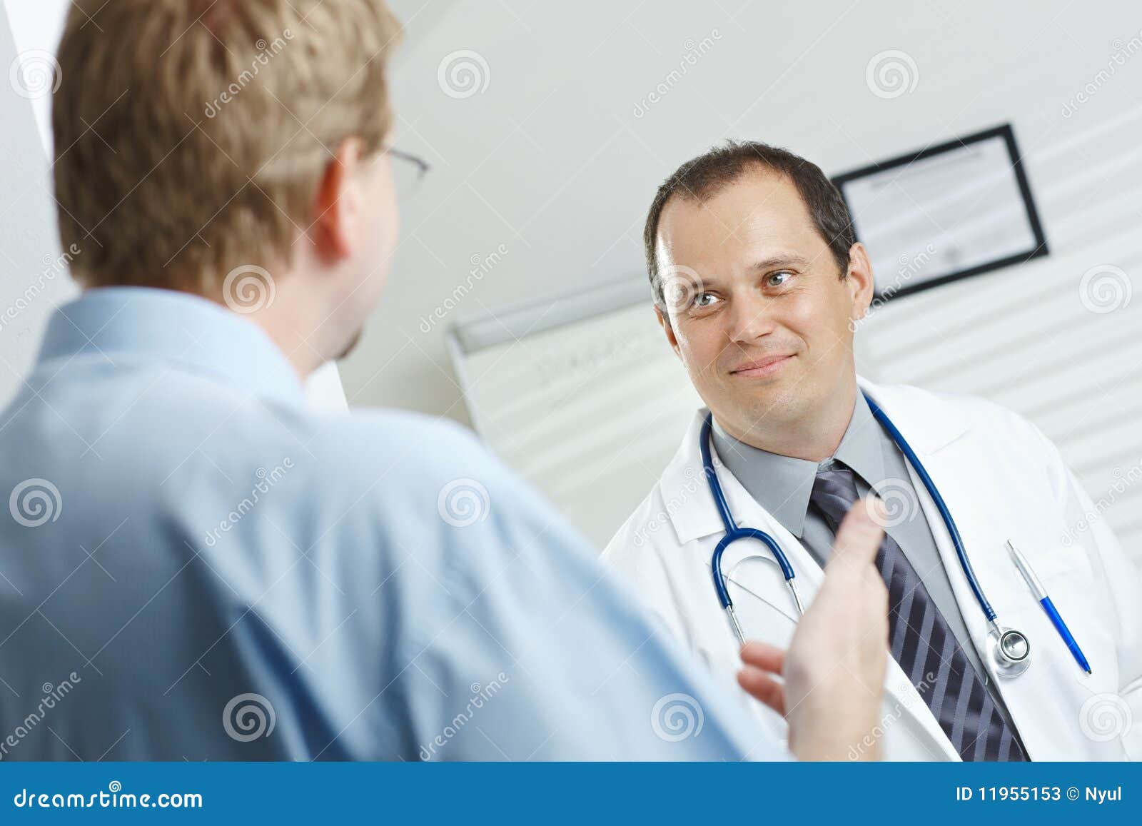 Doctor and patient talking stock image. Image of exam - 11955153
