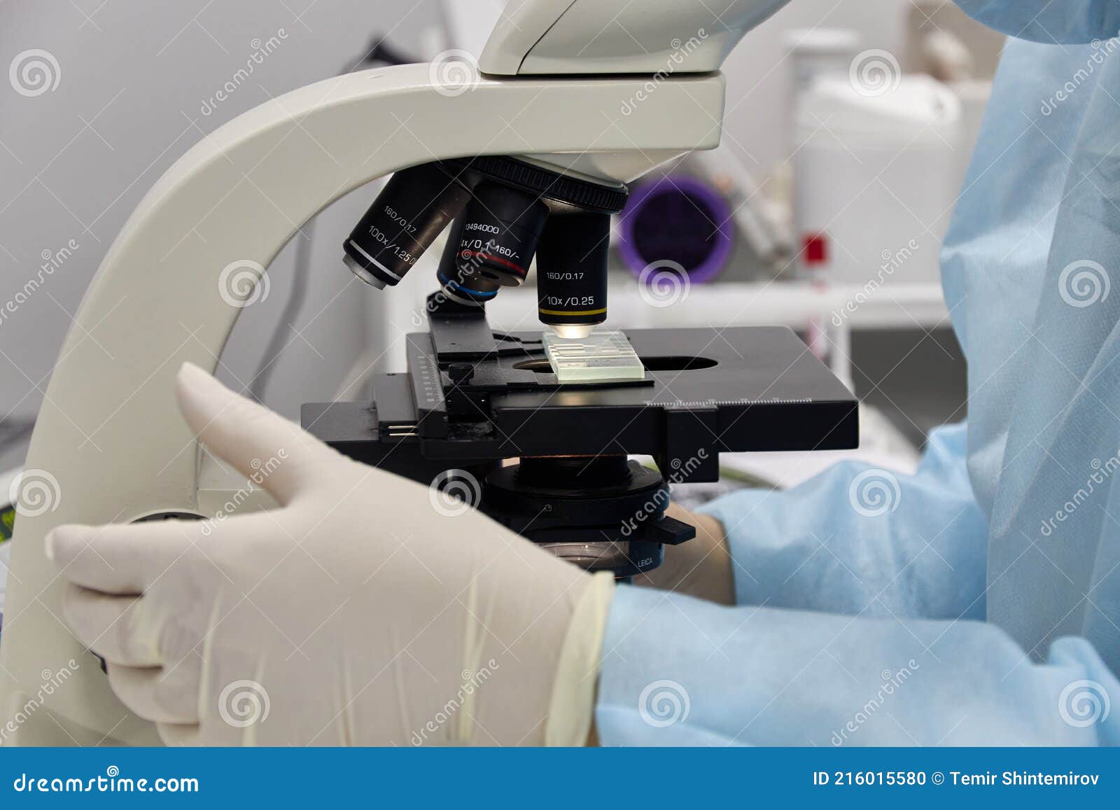 Doctor Performing a Blood Test on a Microscope Stock Photo - Image of ...