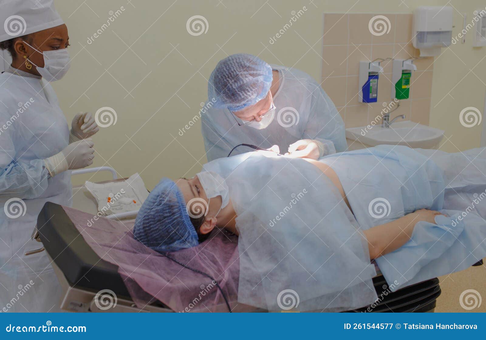 The Doctor Performs the Operation on the Patient Lying on the Operating ...