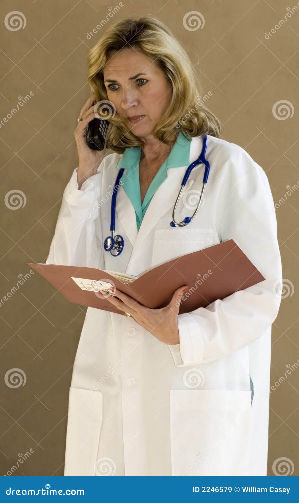 Doctor with Phone and Charts Stock Image - Image of professional ...