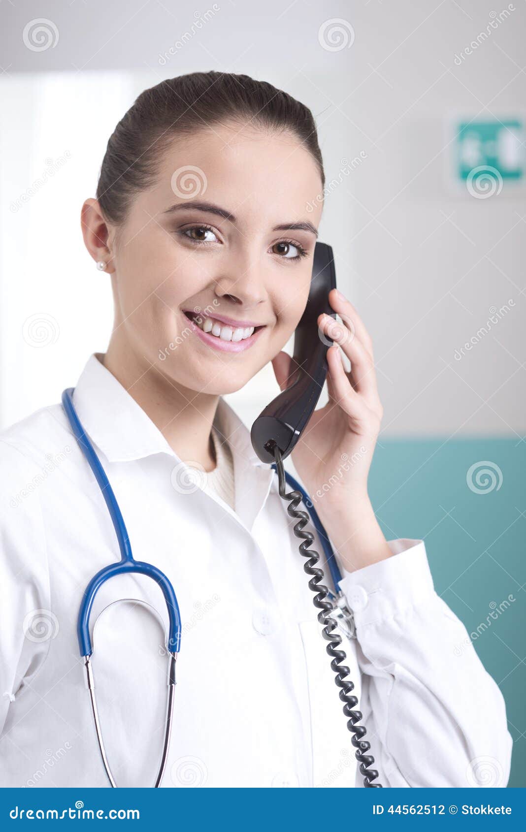 Doctor at phone stock photo. Image of healthcare, scrubs - 44562512