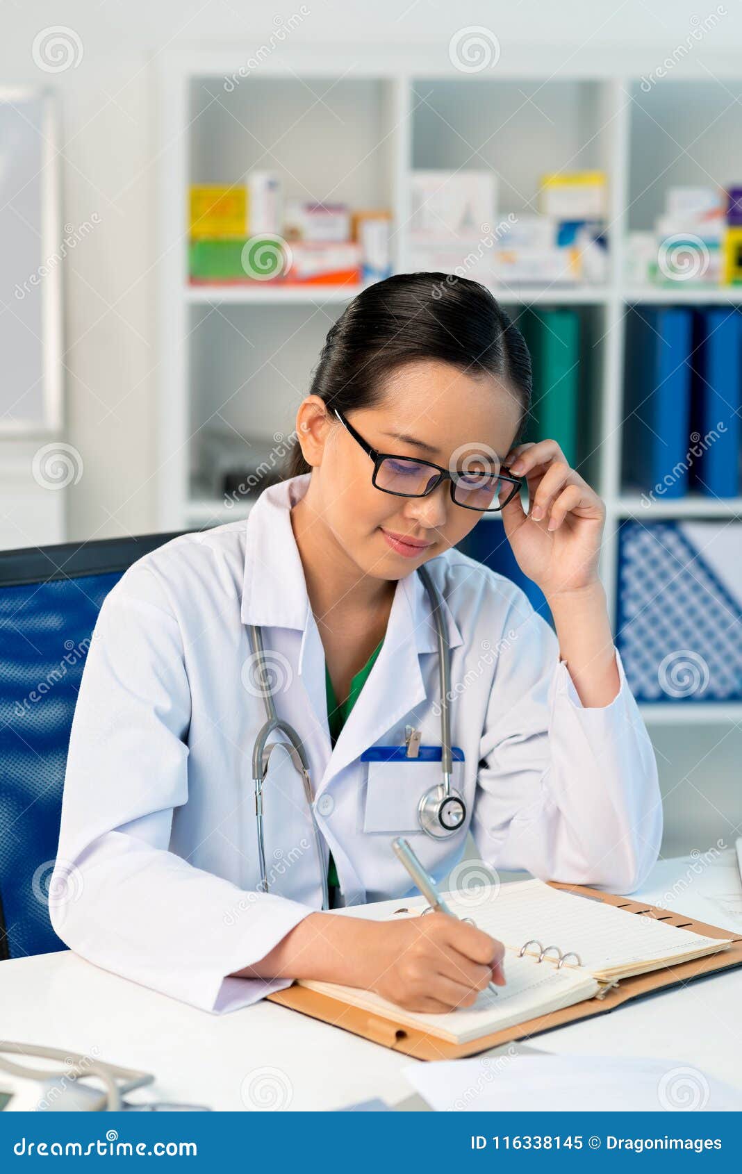 Doctor planning her day stock image. Image of medical - 116338145