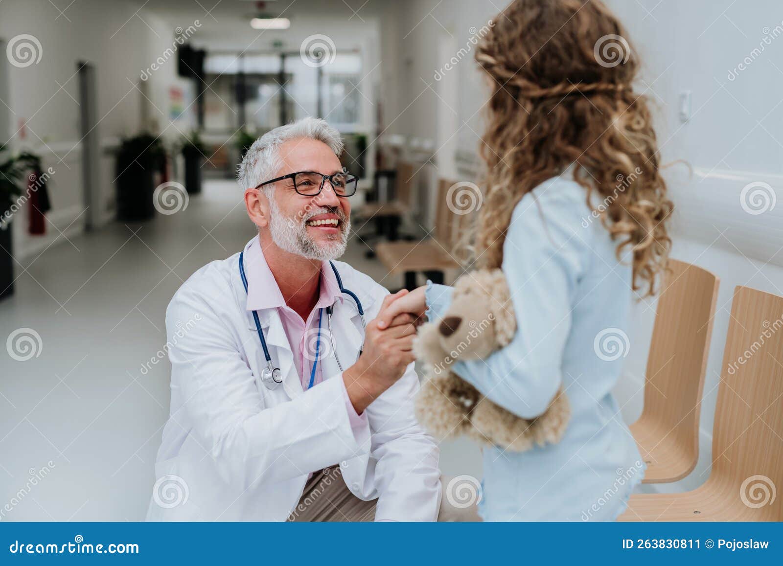 Doctor Playing with His Little Patient at Pediatrics. Stock Image ...