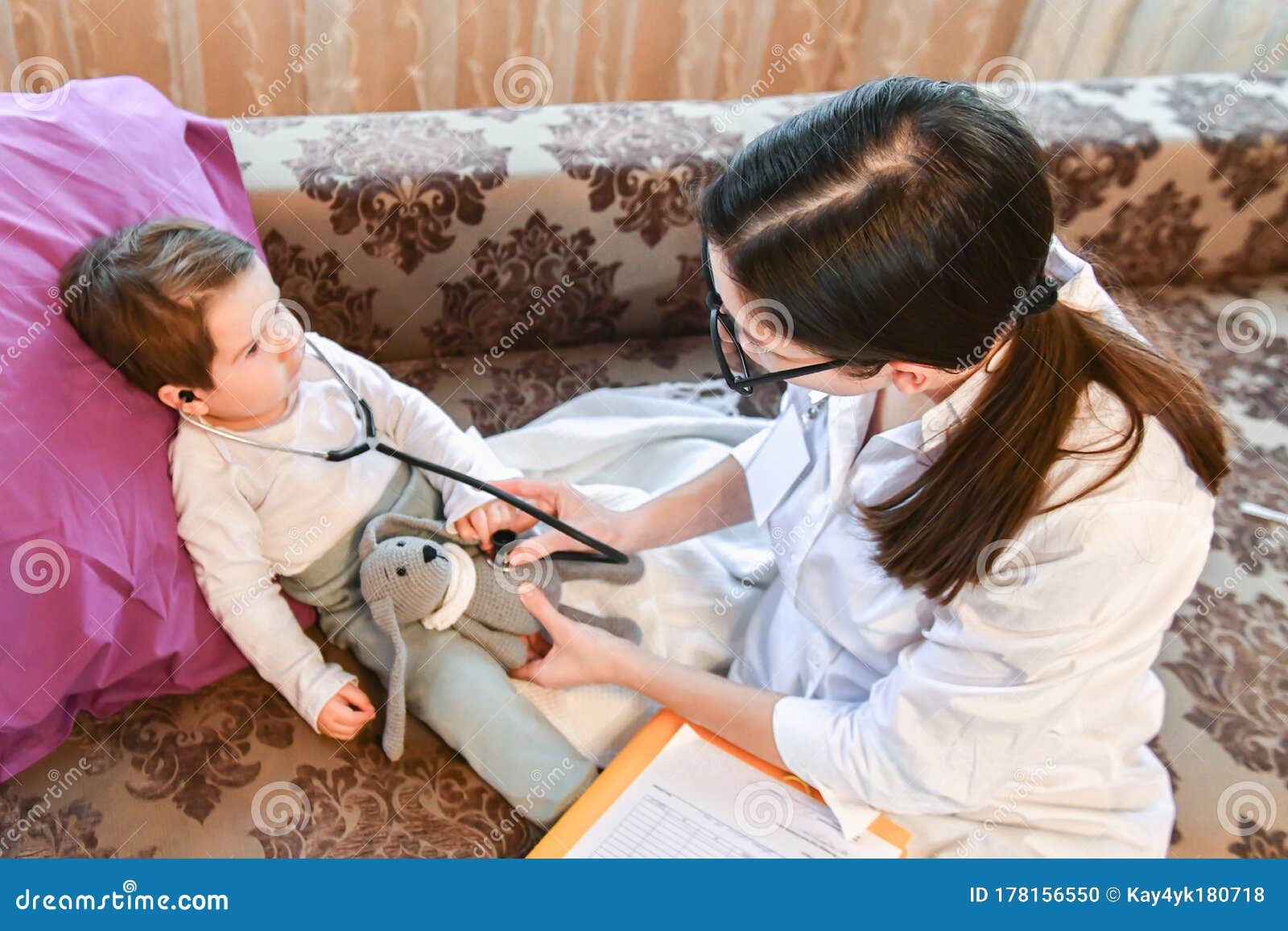 The Doctor Plays with the Child. Family Doctor Stock Photo - Image of ...