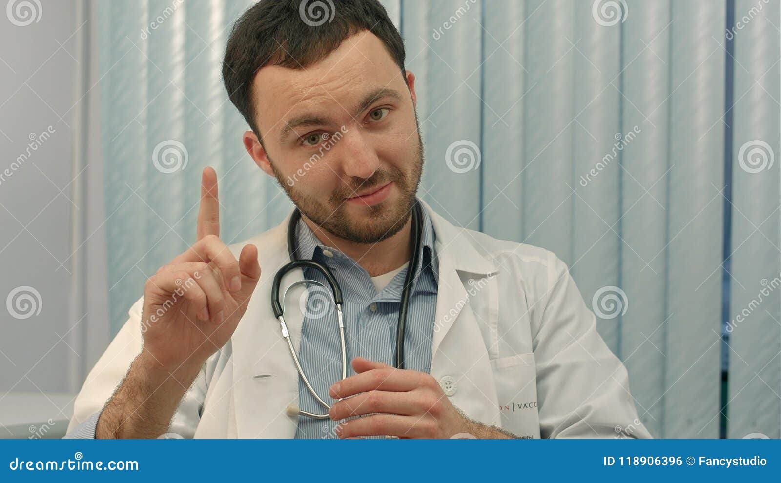 Doctor Pointing Above His Head Towards Blank White Copyspace while ...