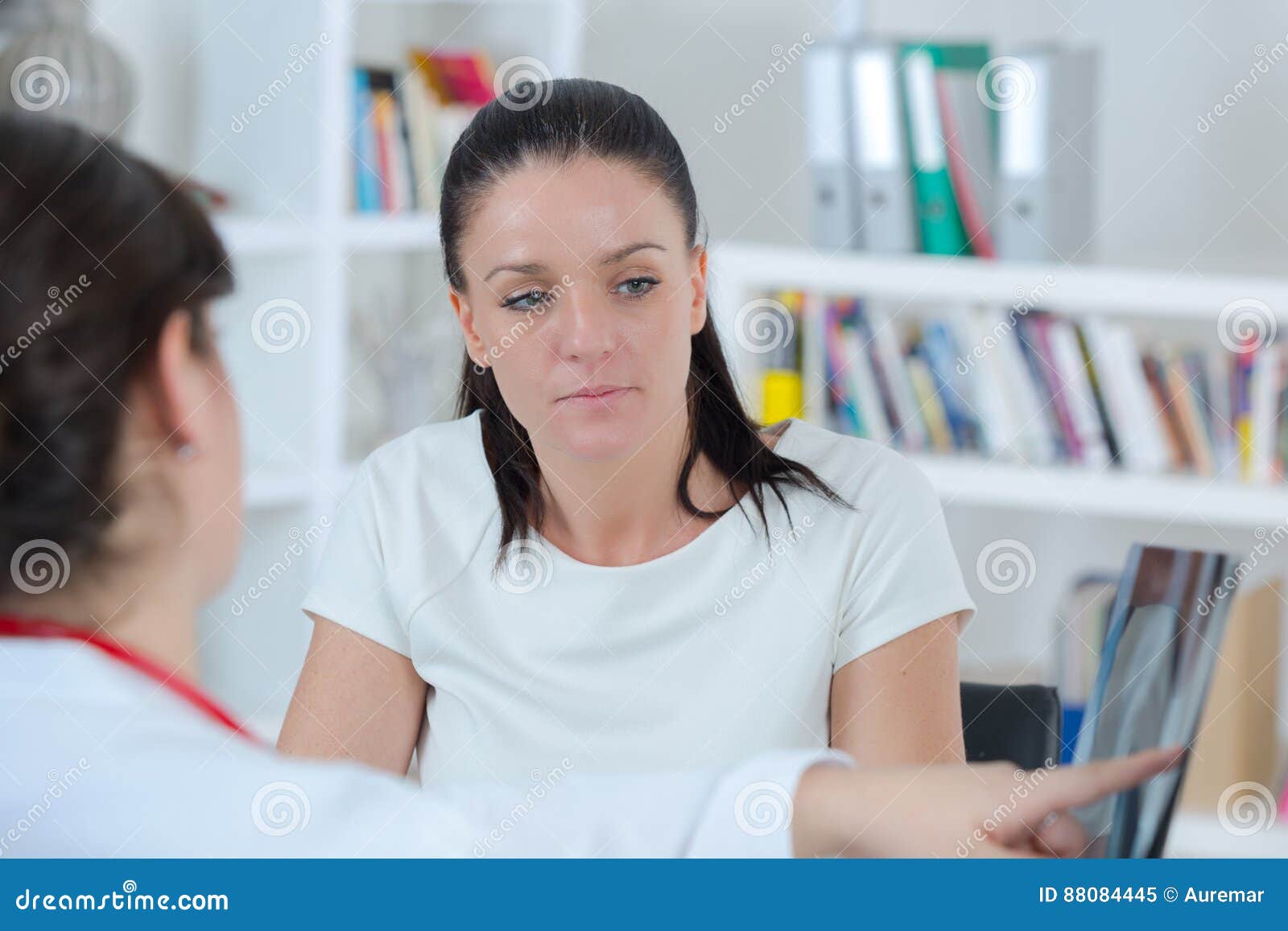 Doctor Pointing at Patient X-ray Sheet in Clinic Stock Image - Image of ...