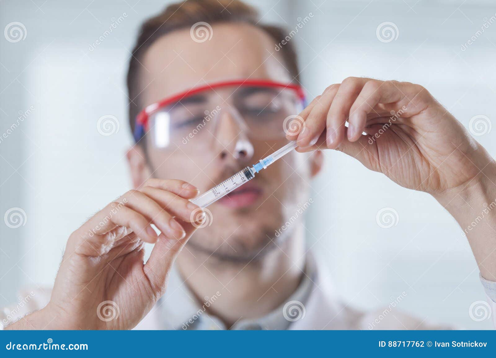 Doctor Preparing a Syringe for Injection Stock Photo - Image of tubes ...