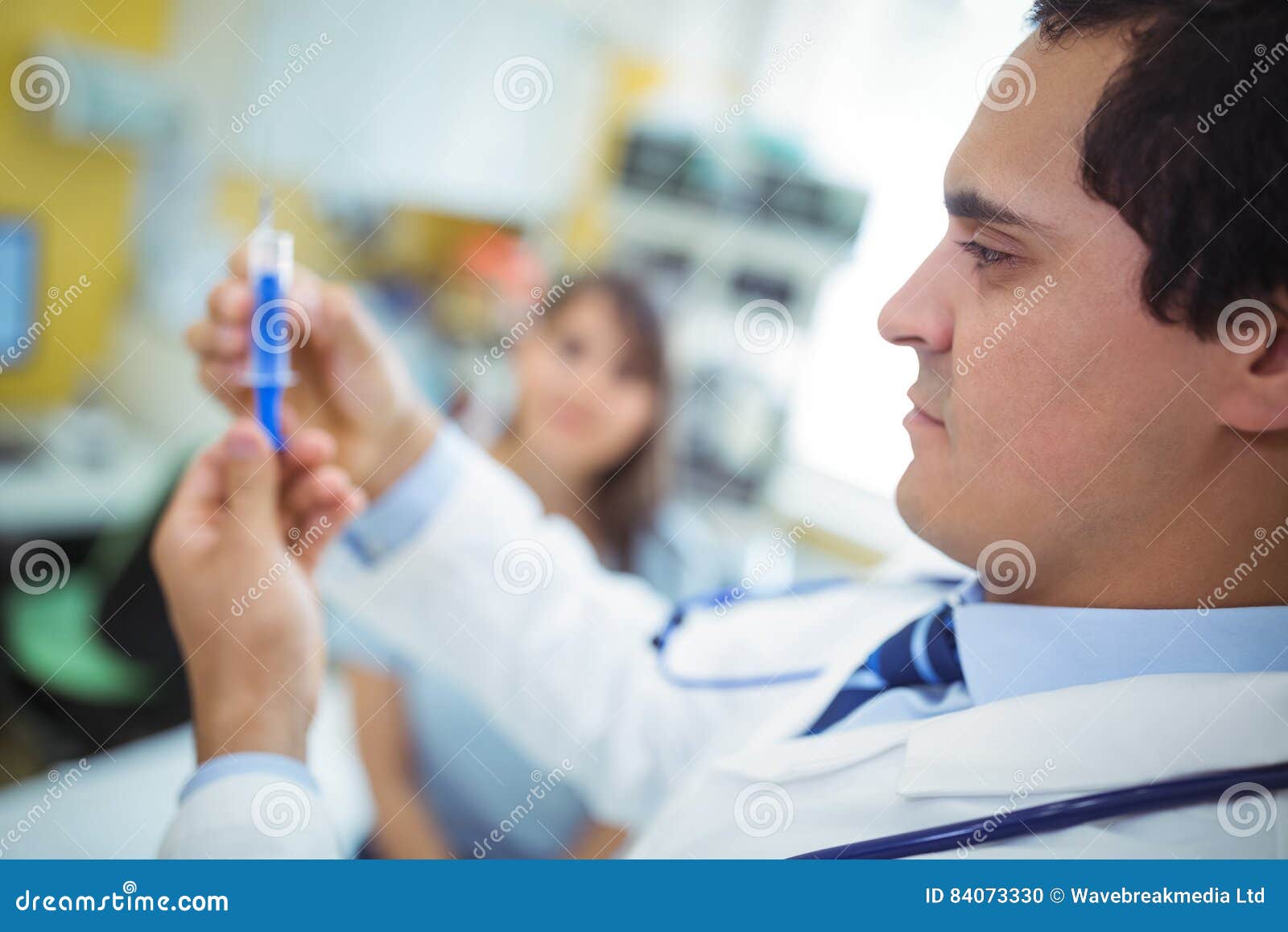 Doctor Preparing a Syringe To Give an Injection Stock Photo - Image of ...