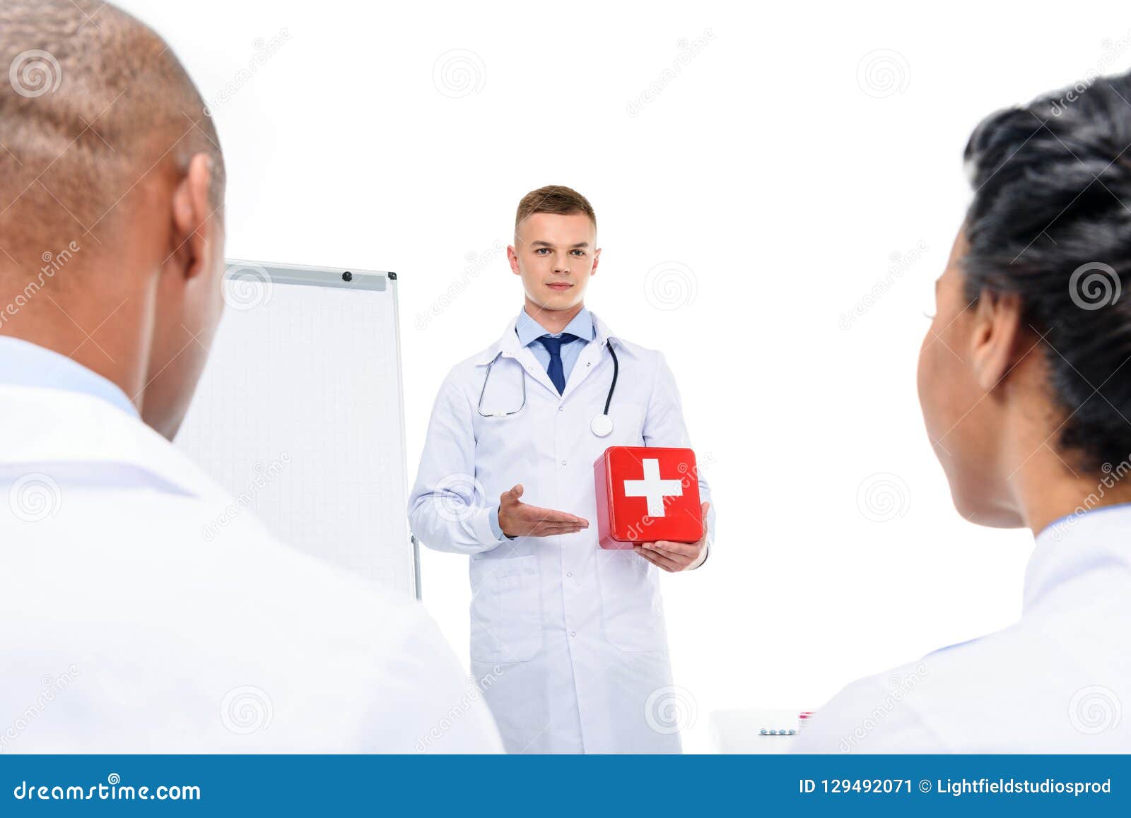 Doctor Presenting First Aid Kit Stock Image - Image of multiethnic ...