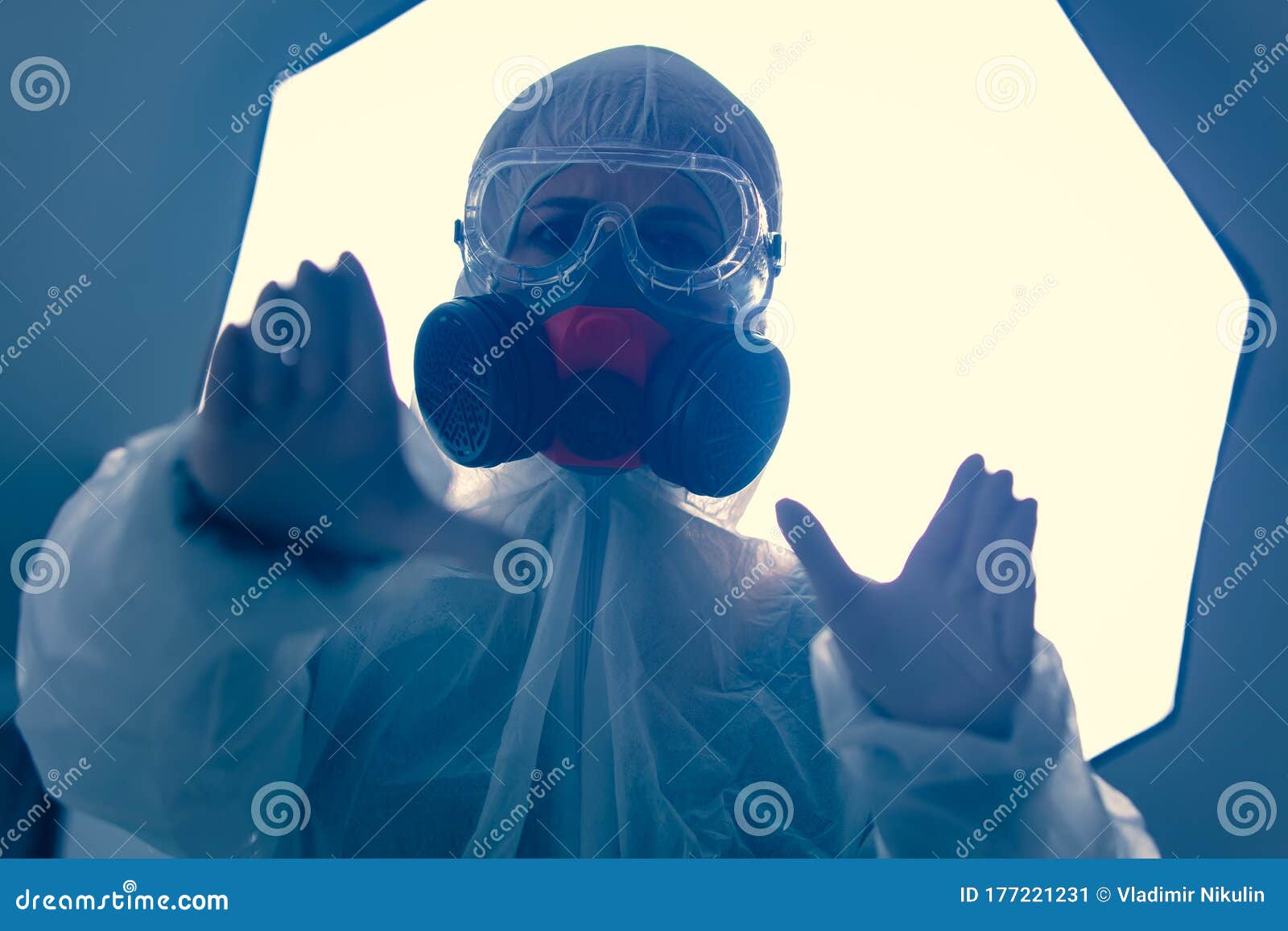 Doctor in Protection Clothes in Laboratory with Light on Background ...