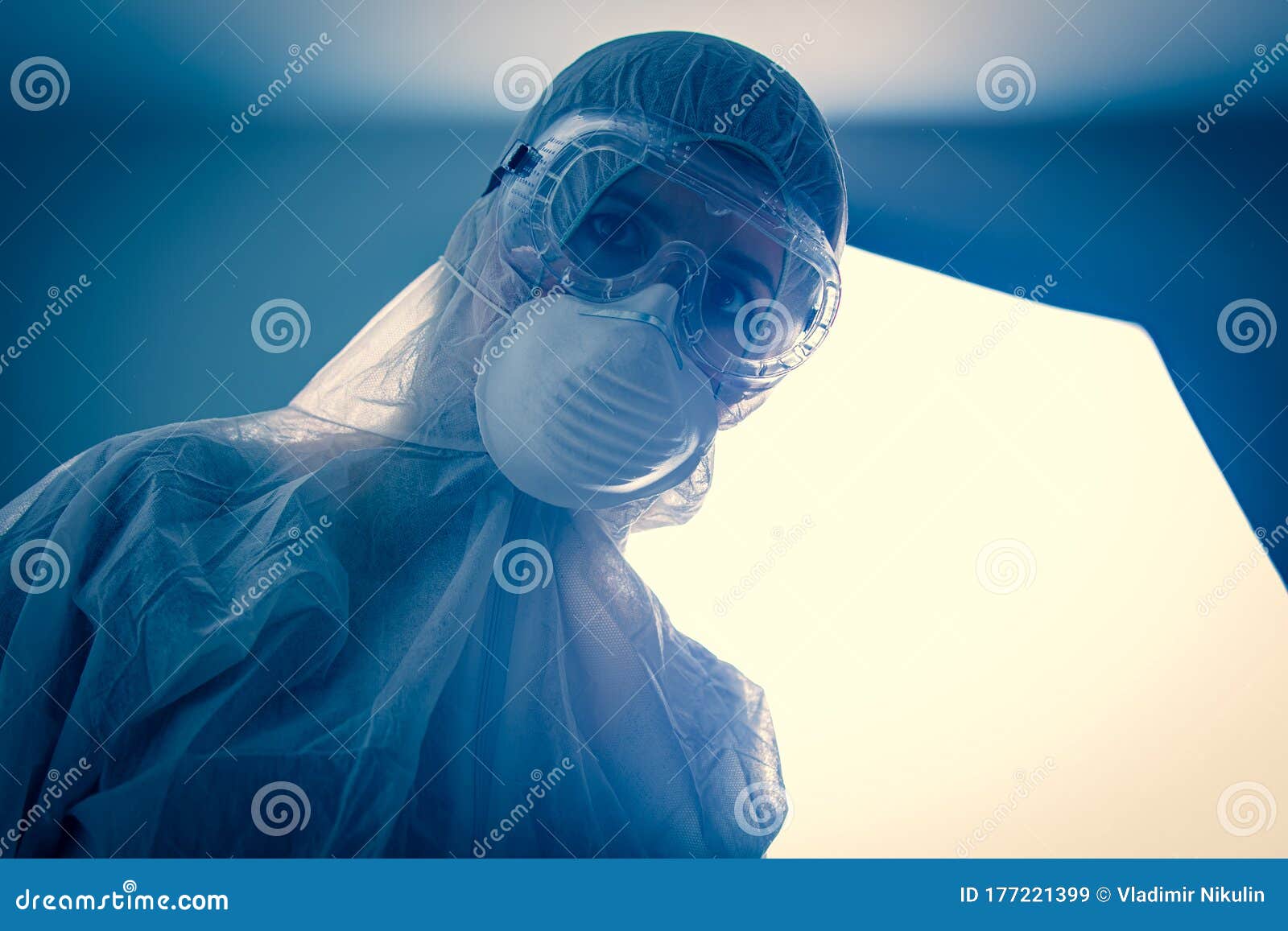 Doctor in Protection Clothes in Laboratory with Light on Background ...