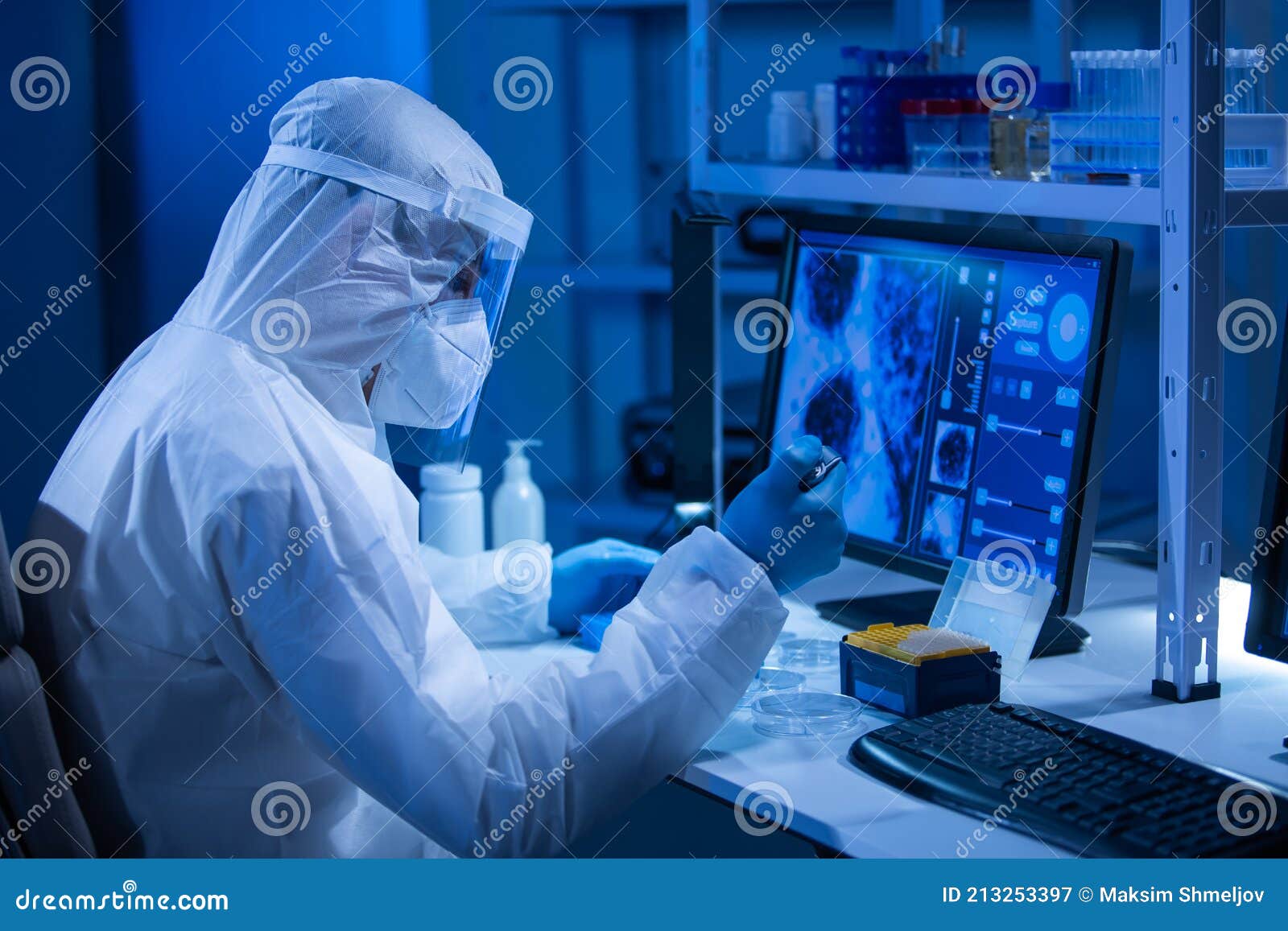 Doctor in Protective Suit is Doing a Science Experiments and Developing ...