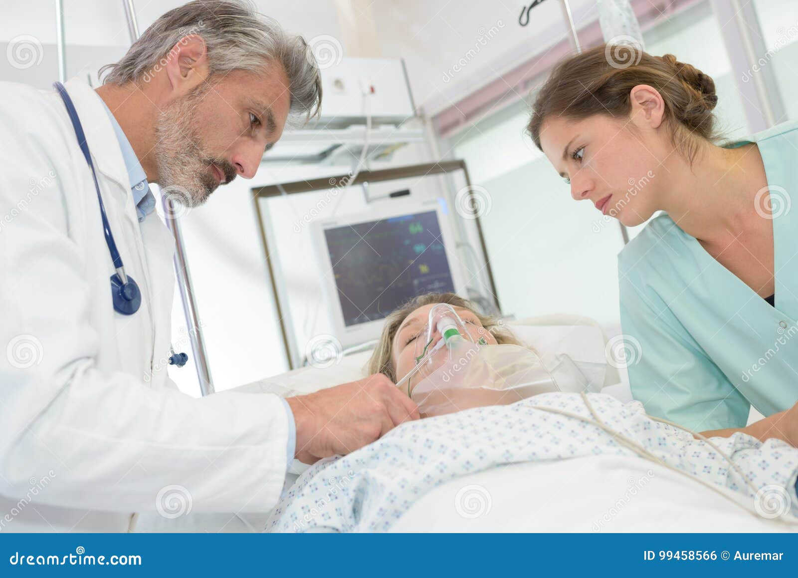 Doctor Putting Oxygen Mask on Patient at Hospital Stock Photo - Image ...