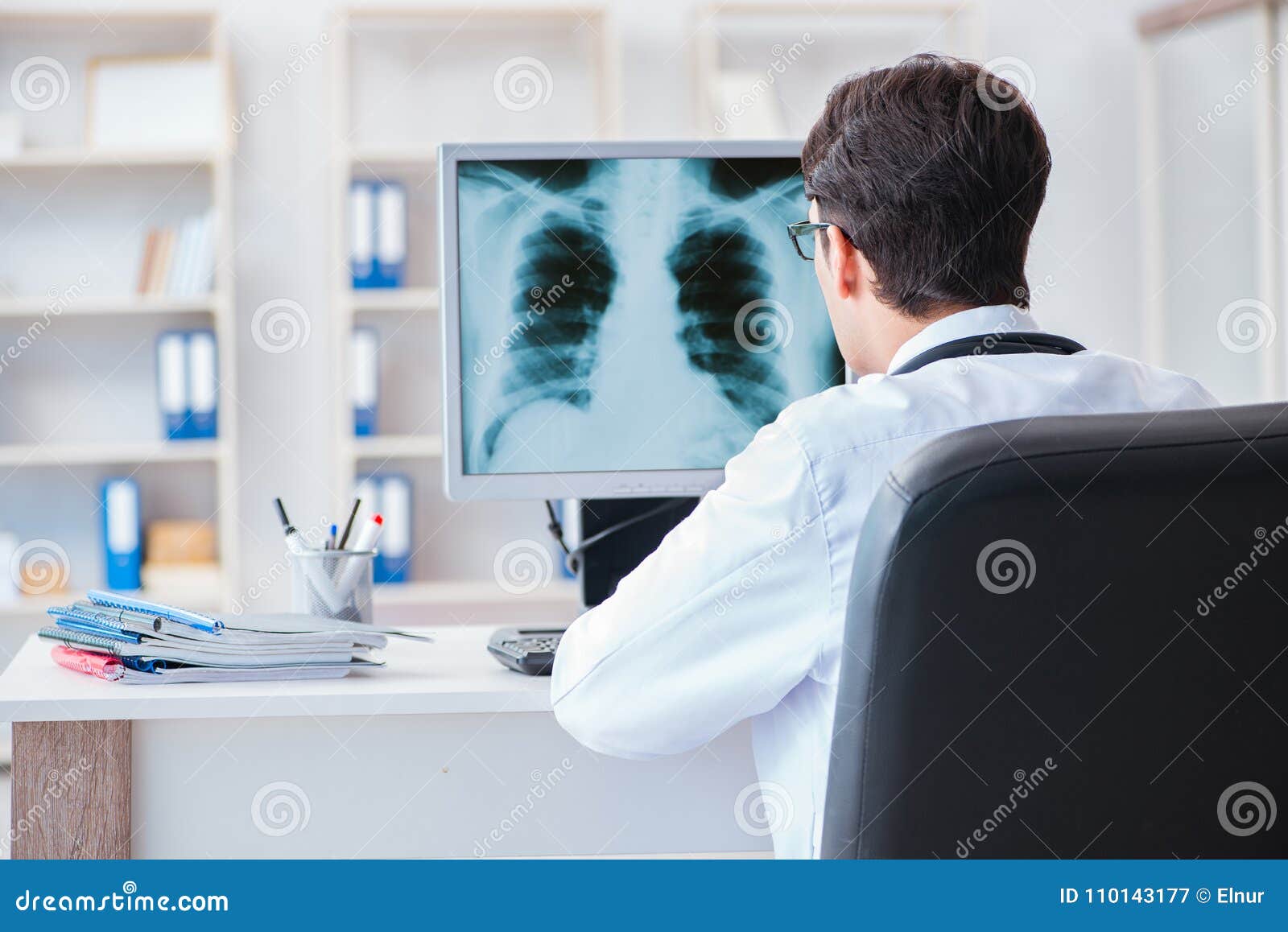 The Doctor Radiologist Looking at X-ray Images Stock Image - Image of ...