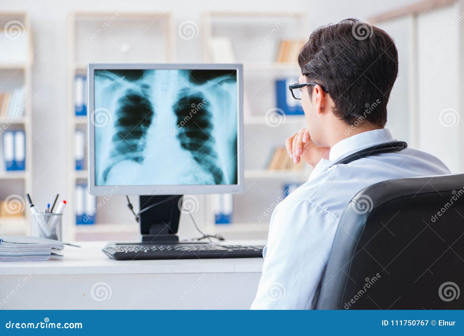 The Doctor Radiologist Looking at X-ray Images Stock Image - Image of ...