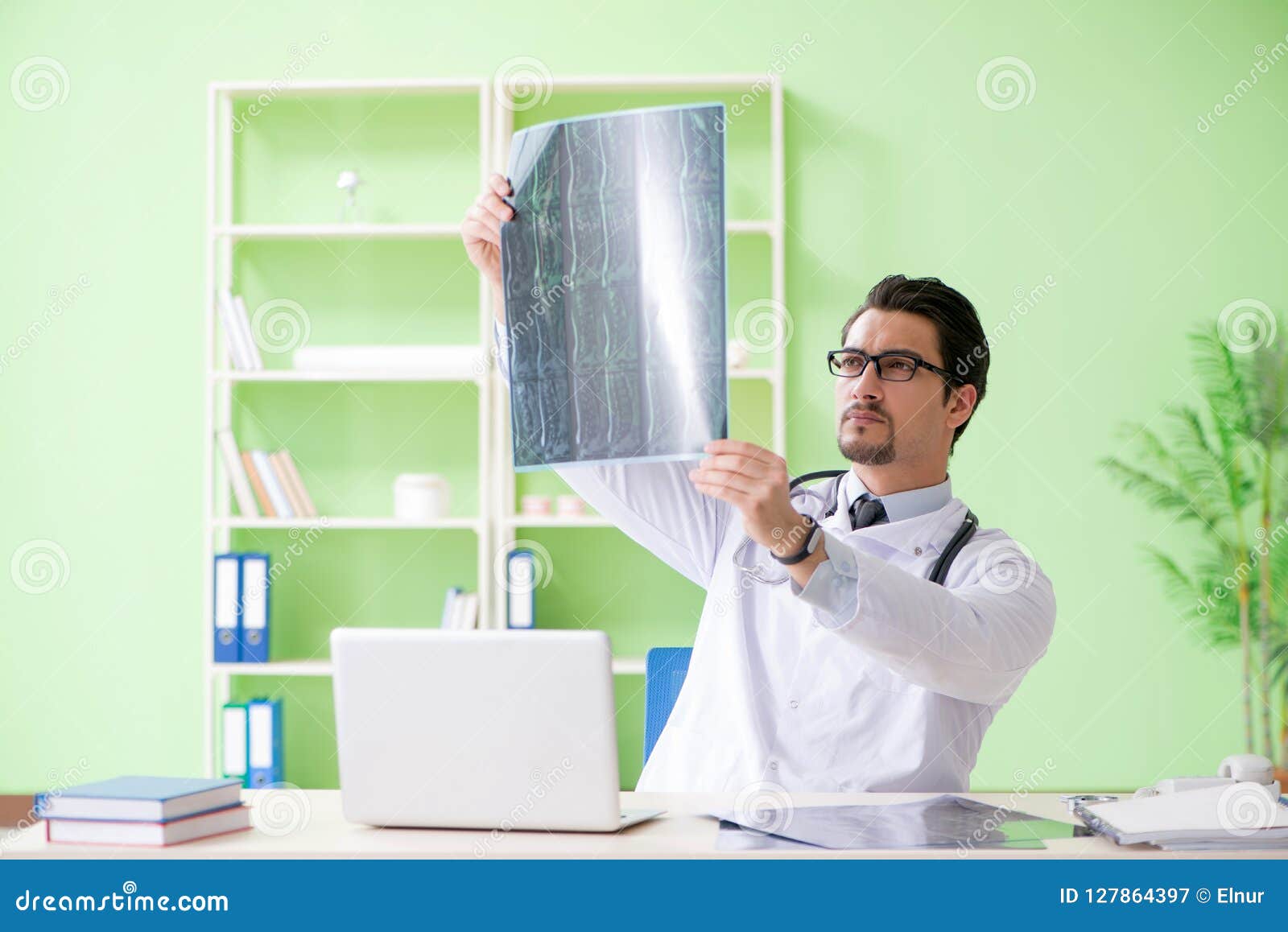 The Doctor Radiologist Looking at X-ray Scan in Hospital Stock Image ...