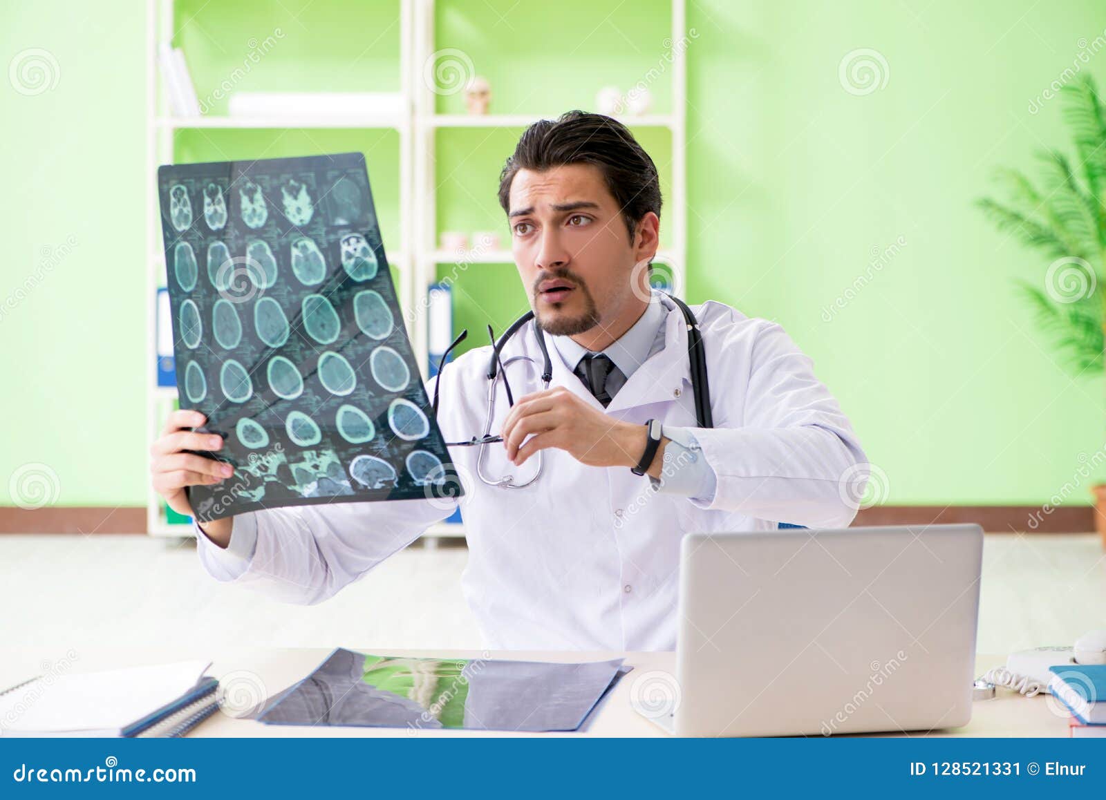 The Doctor Radiologist Looking at X-ray Scan in Hospital Stock Image ...