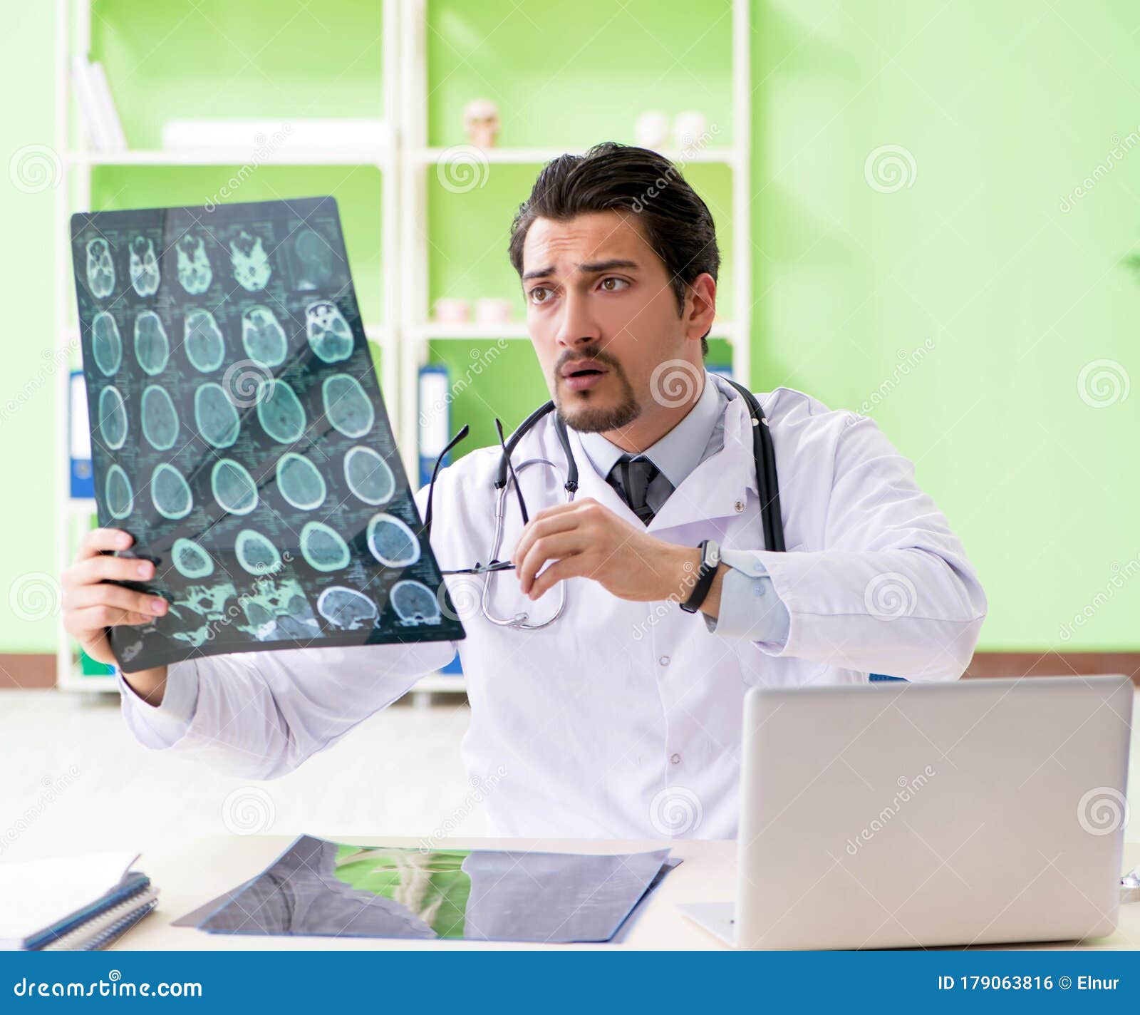 Doctor Radiologist Looking at X-ray Scan in Hospital Stock Photo ...