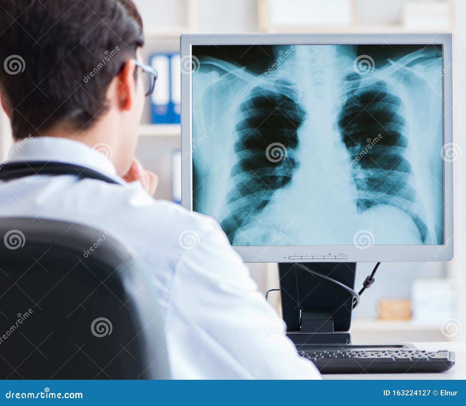 Doctor Radiologist In Hospital Looking At Mri X-ray Scan Of Brain, Head ...