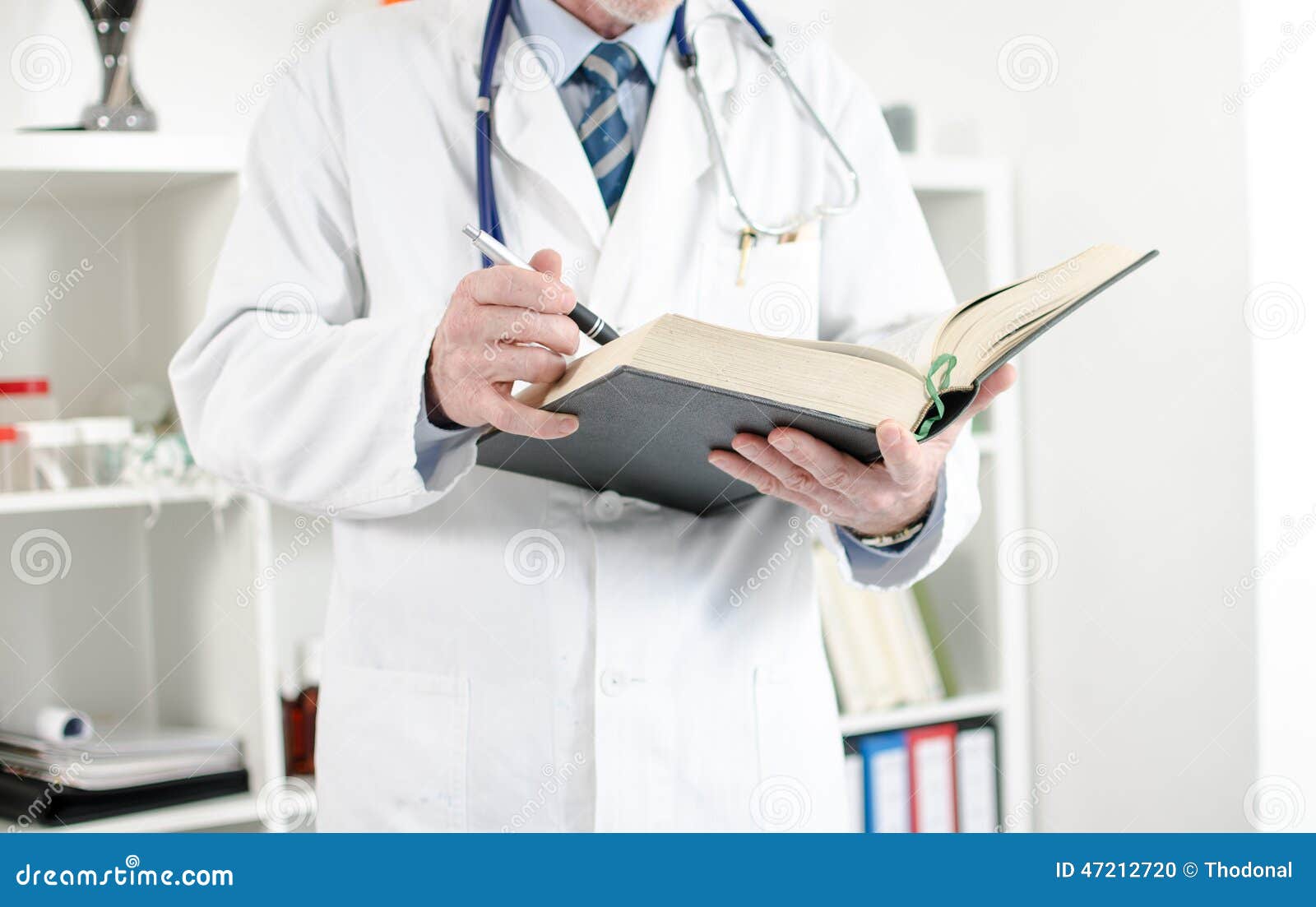 Doctor Reading a Medical Book Stock Photo - Image of book, physics ...